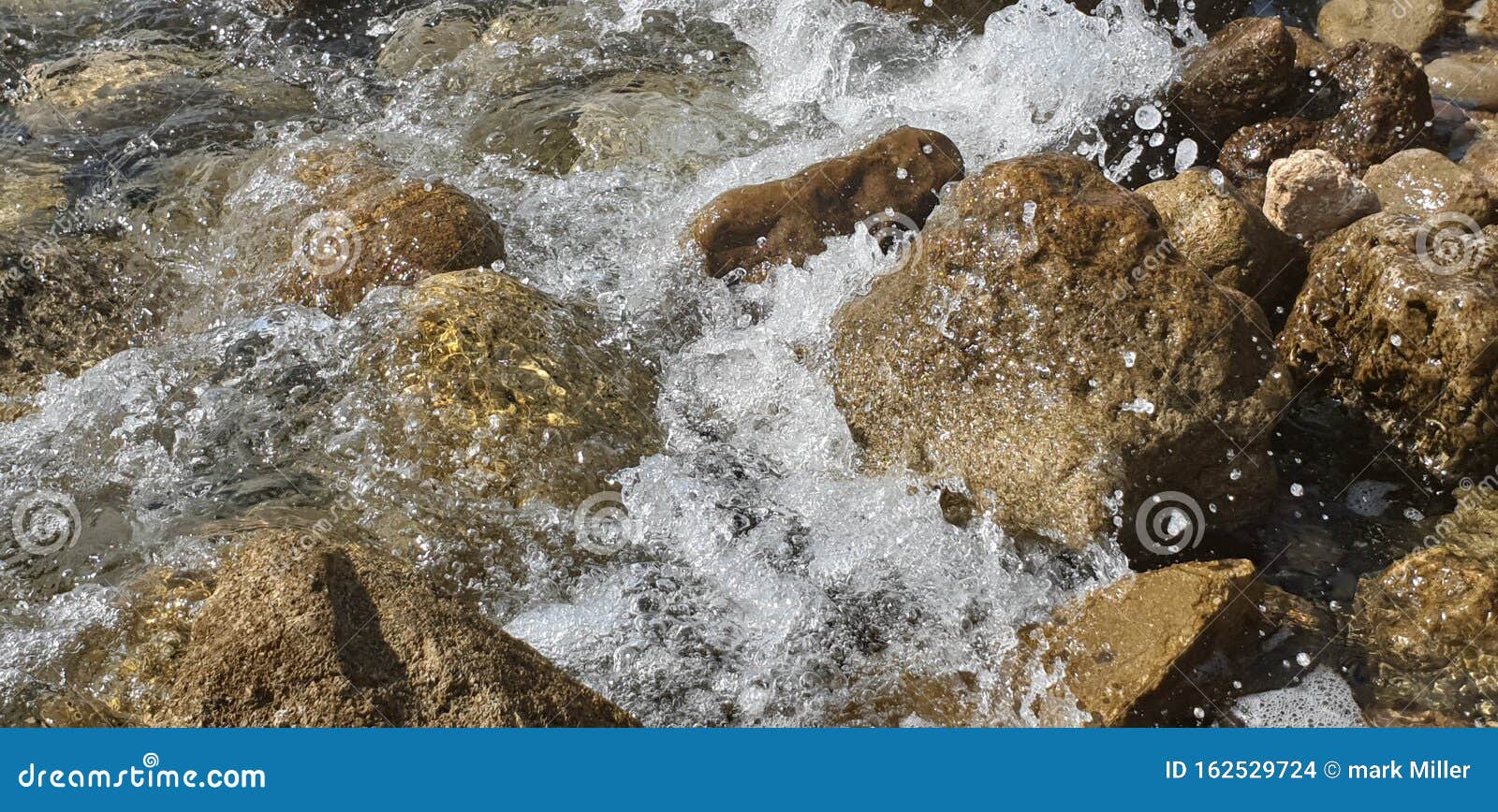 Sea washing over the rocks stock photo. Image of washing - 162529724