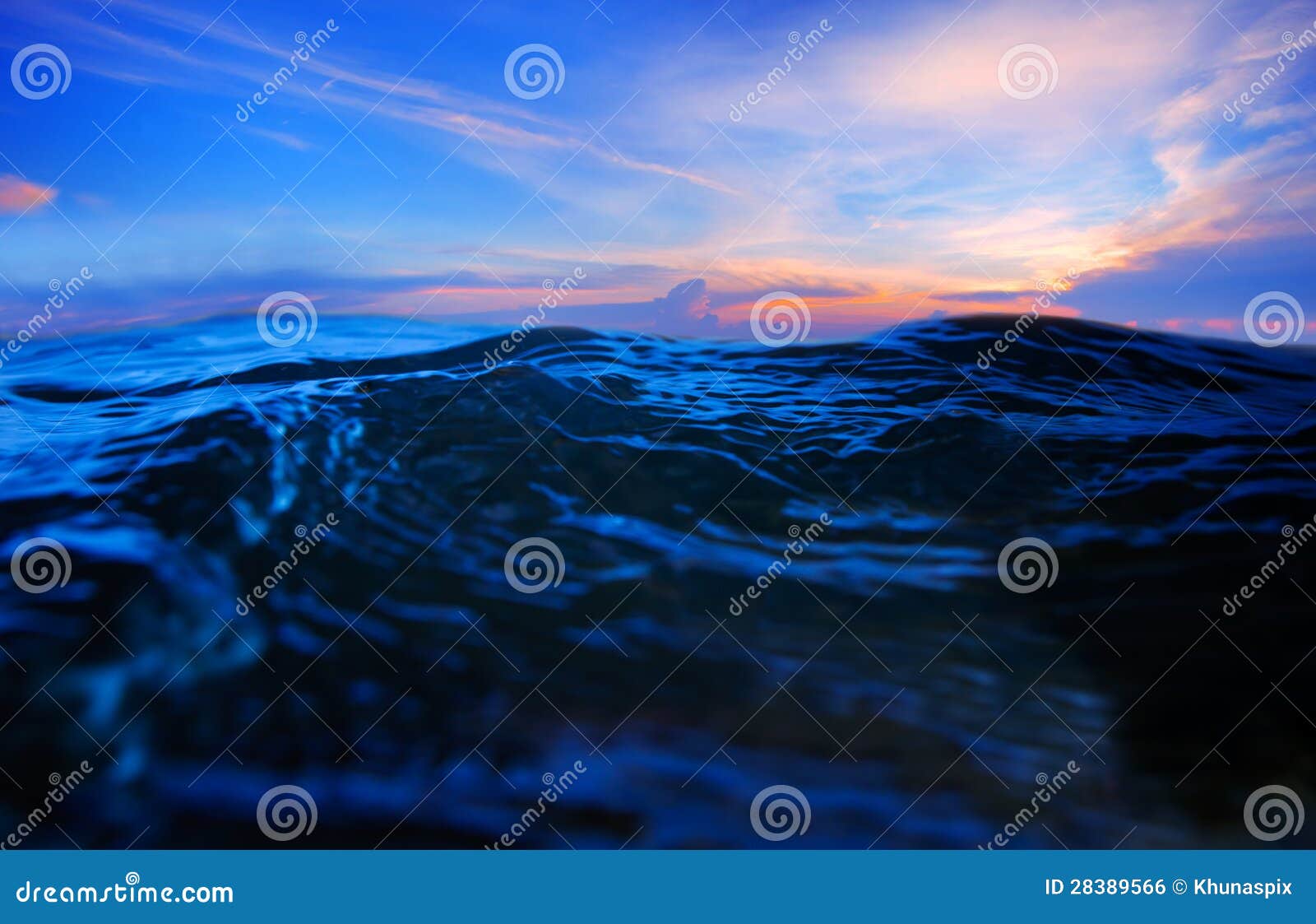 Sea Water Splashing with Dramatic Colorful Sky in Evening Stock Photo ...
