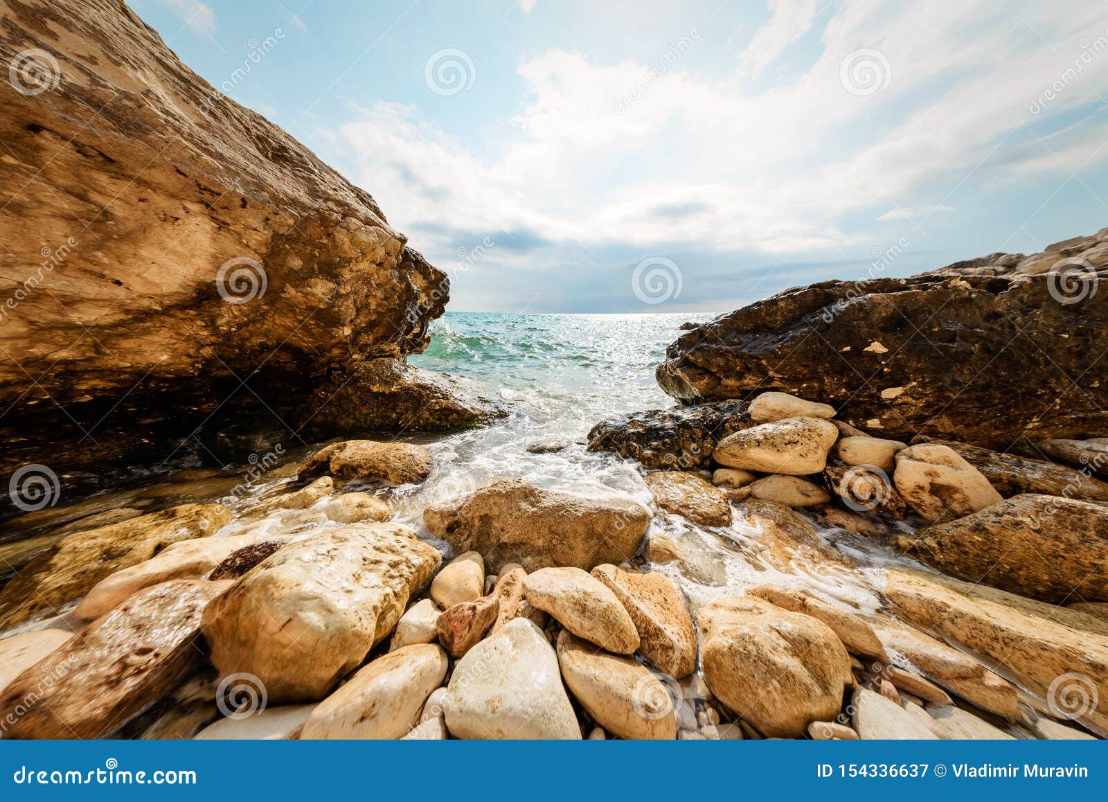 Sea wave on a rocky shore stock image. Image of scene - 154336637