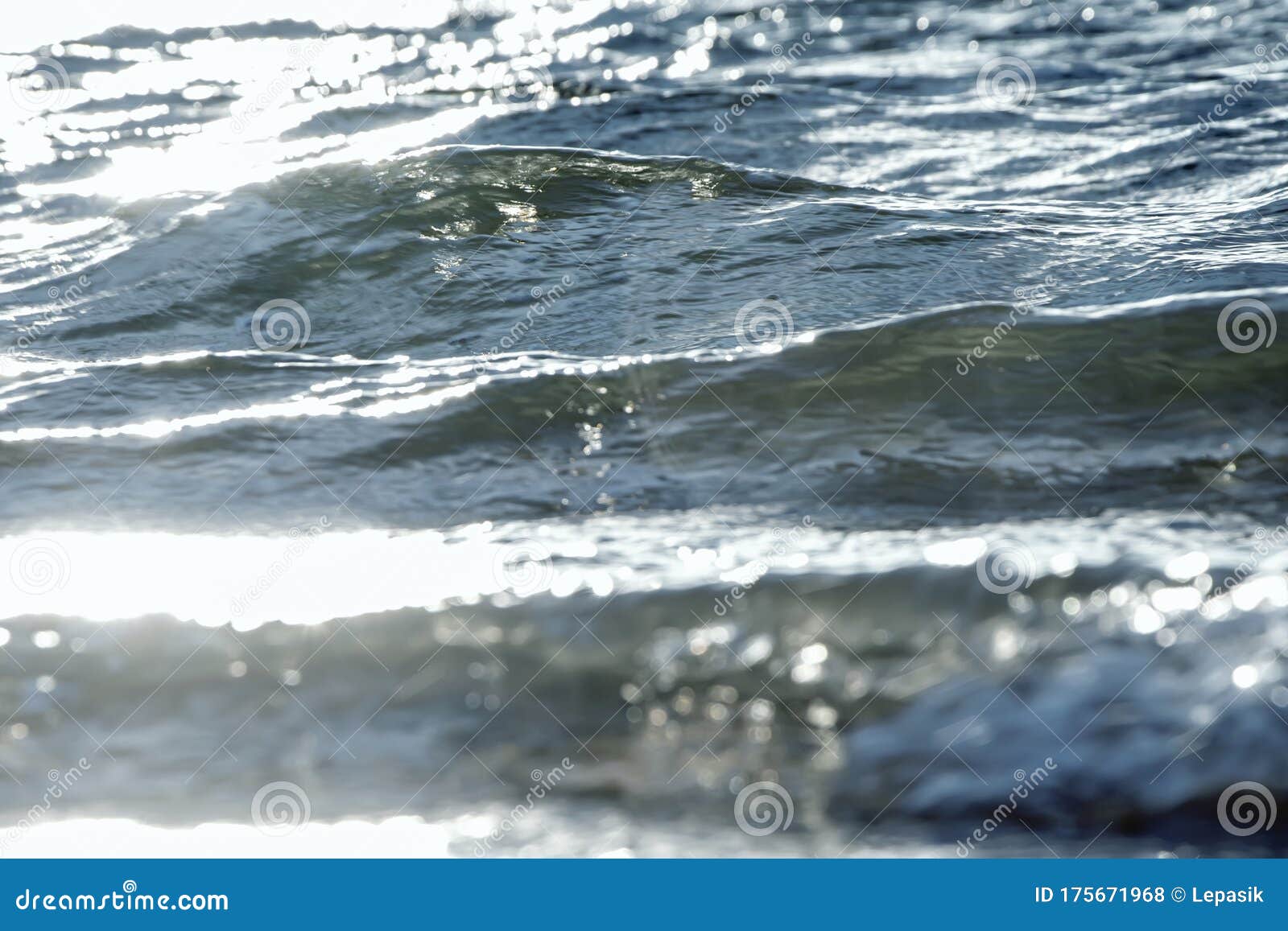 The Sea Wave Runs Over the Sandy Beach, Shimmering in the Rays of ...