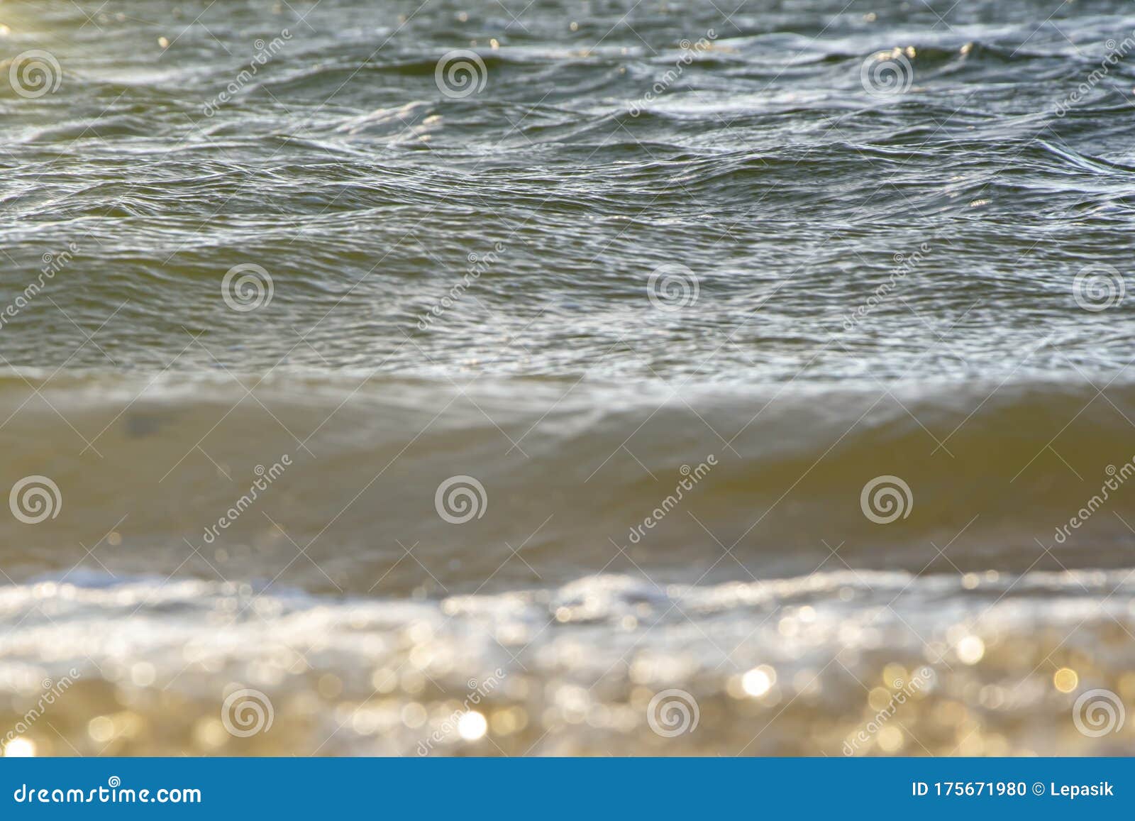 The Sea Wave Runs Over the Sandy Beach, Shimmering in the Rays of ...