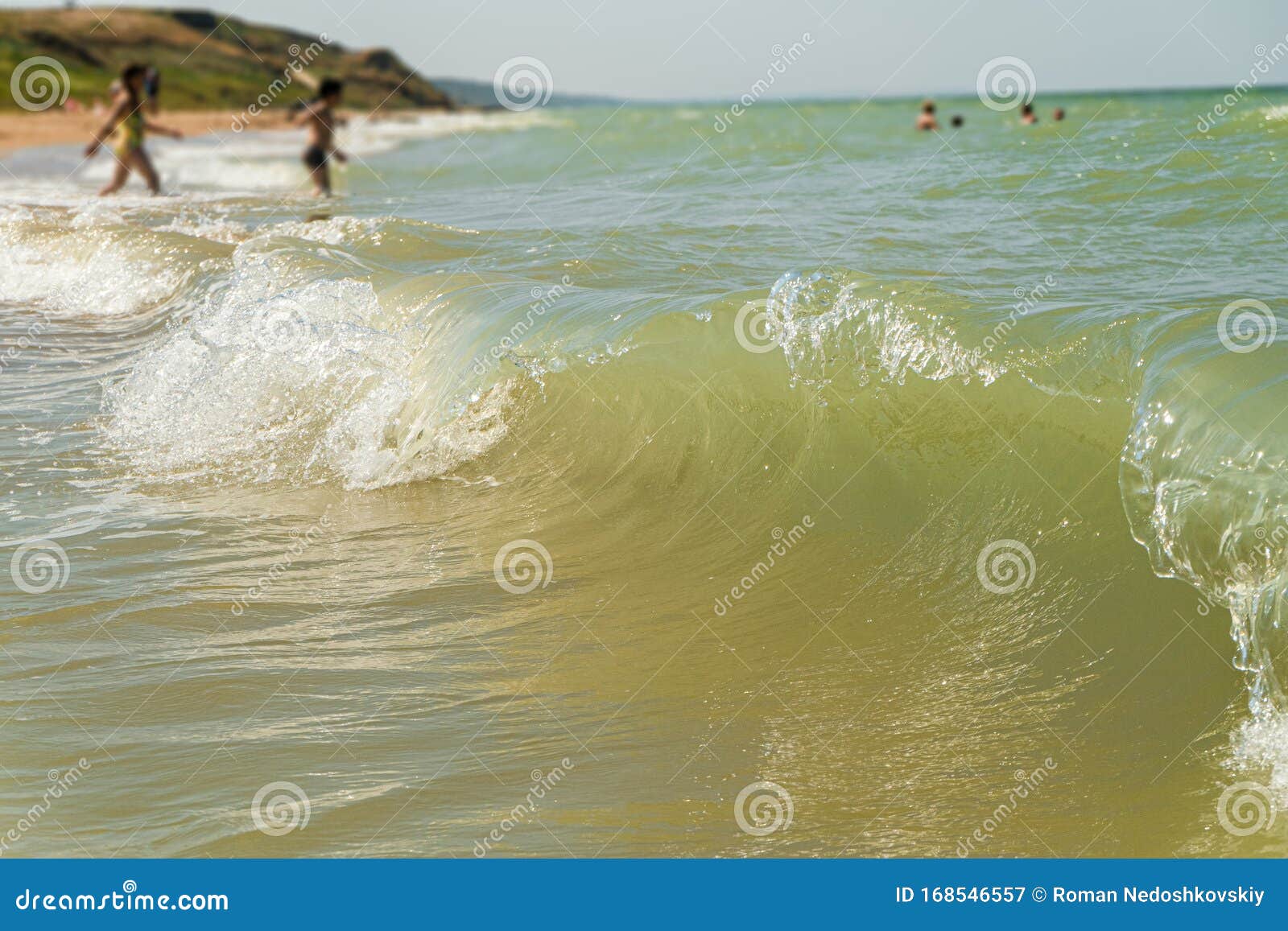 Sea Waves Falls on Beach. People Swimming in the Sea Stock Image ...