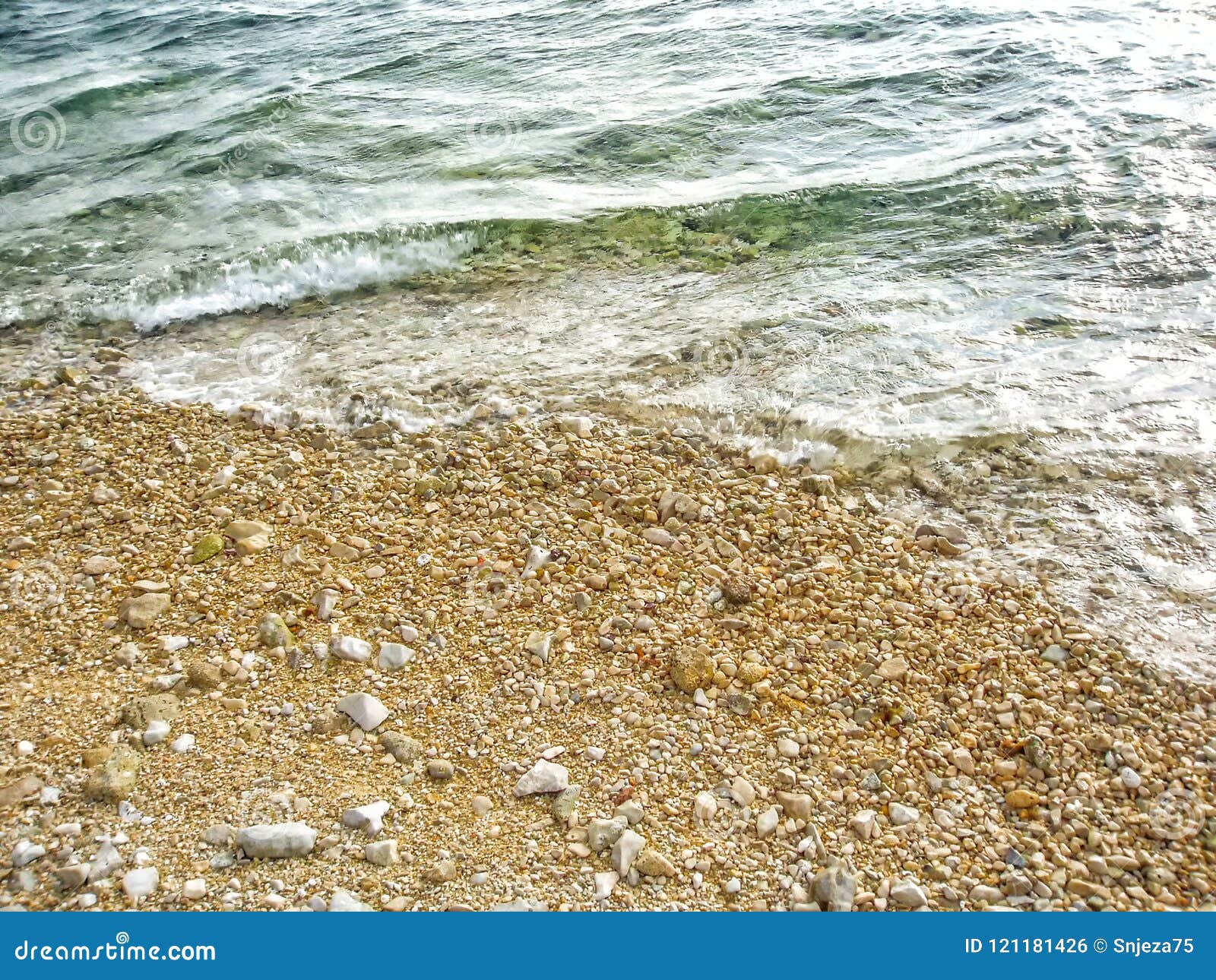 Sea Waves Hitting a Colorful Pebble Beach Stock Photo - Image of ...