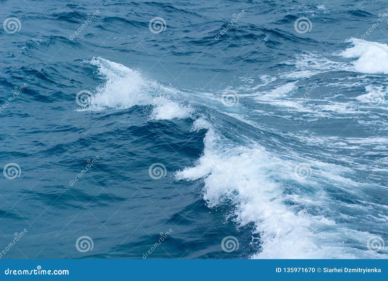 Waves On The Surface Of The Sea Water At Dusk With Compact, Solid And ...