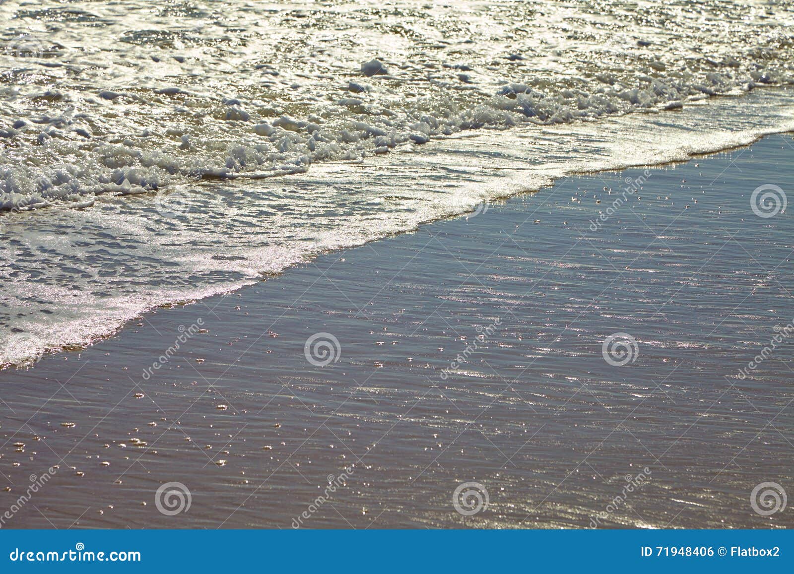 Seafoam on a sandy beach stock photo. Image of blue, balearic - 71948406