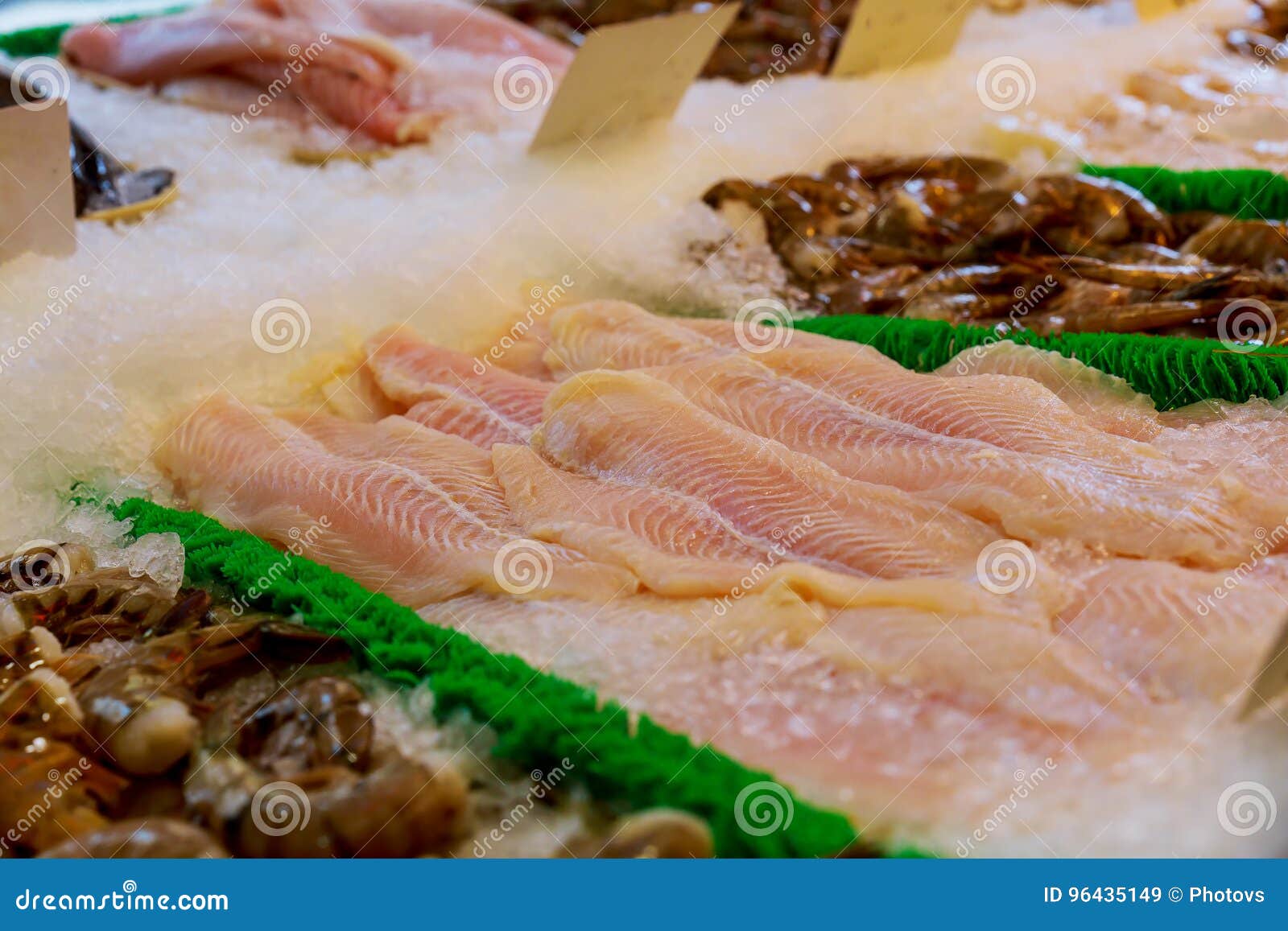 Seafood Counter Display of Fish. White Cod and Tilapia Fillets Stock ...