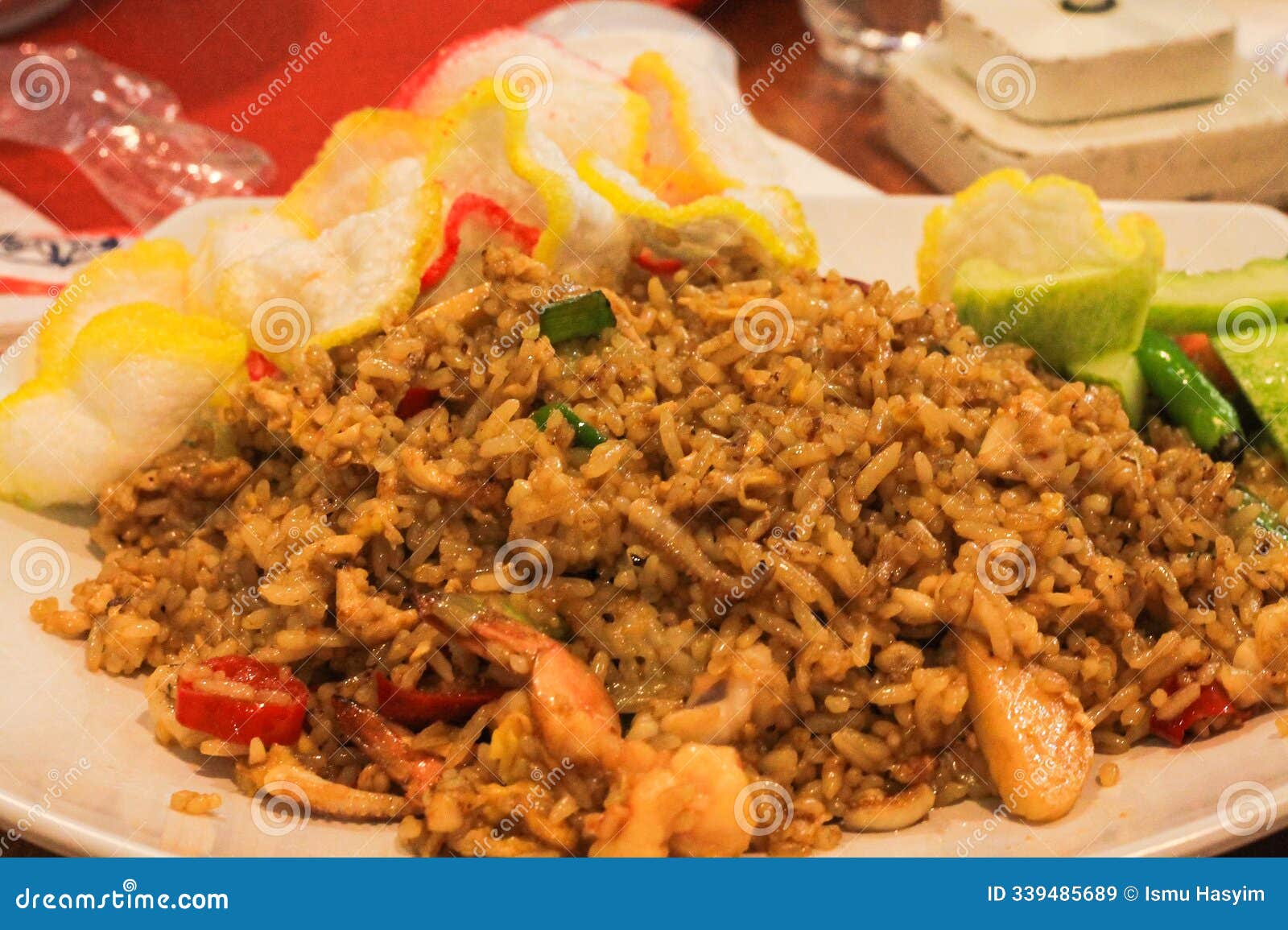 Seafood Fried Rice with Pickles and Crackers on a Plate Stock Image ...