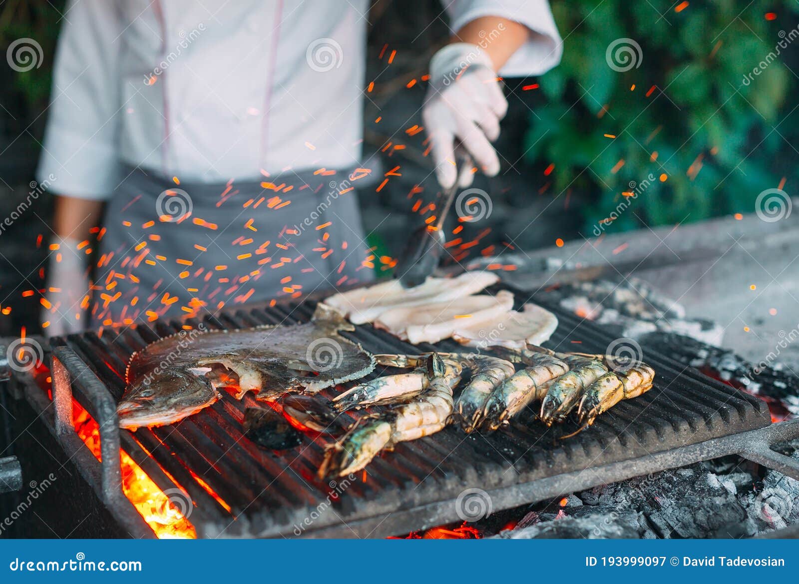 Seafood on the Grill. Mussels, Shrimp, Squid and Fish are Cooked on ...