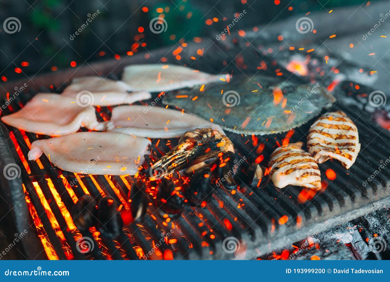 Seafood on the Grill. Mussels, Shrimp, Squid and Fish are Cooked on ...