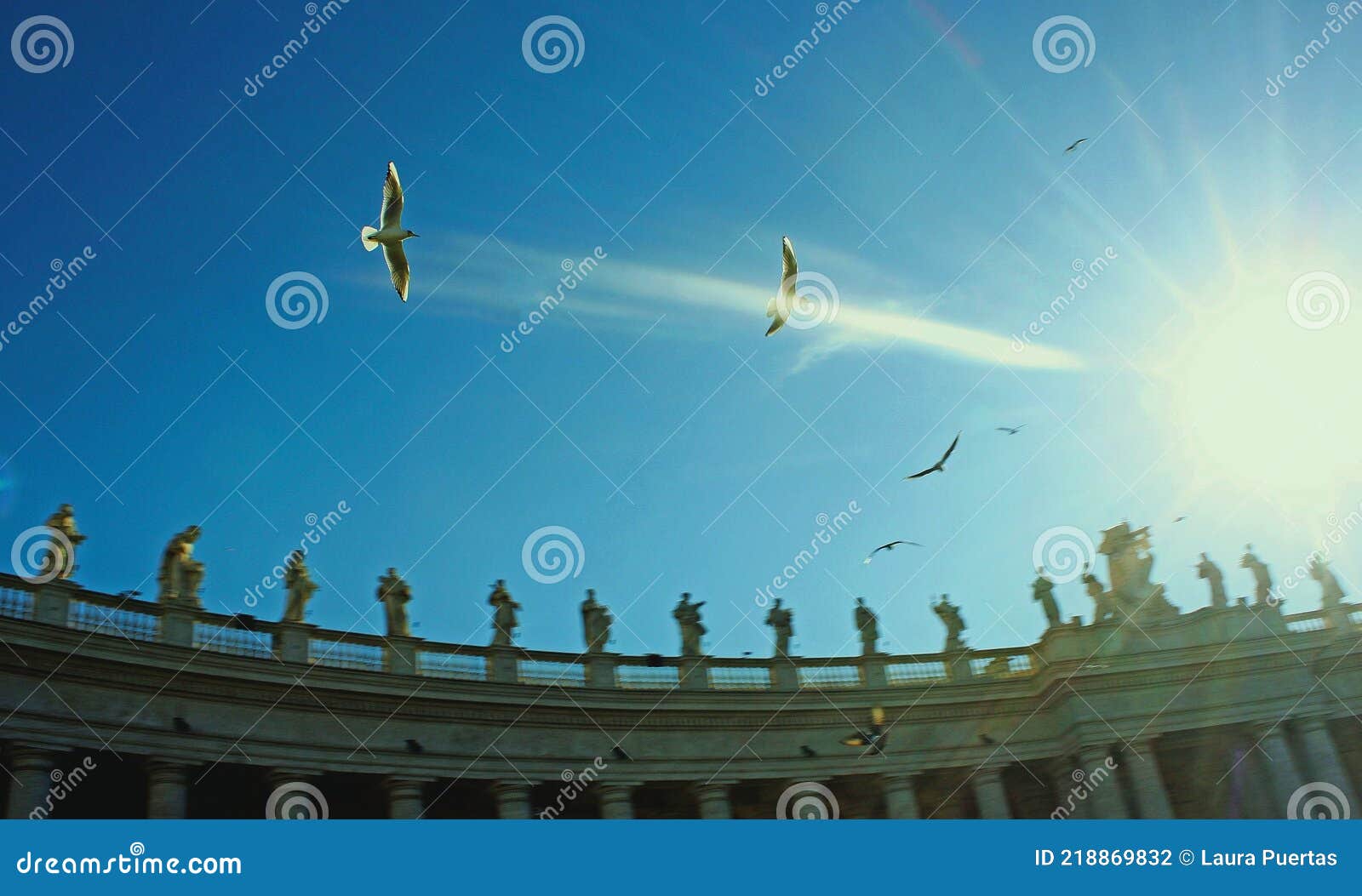 Seagull Flying Viewed from Below with Statues in the Background Stock ...
