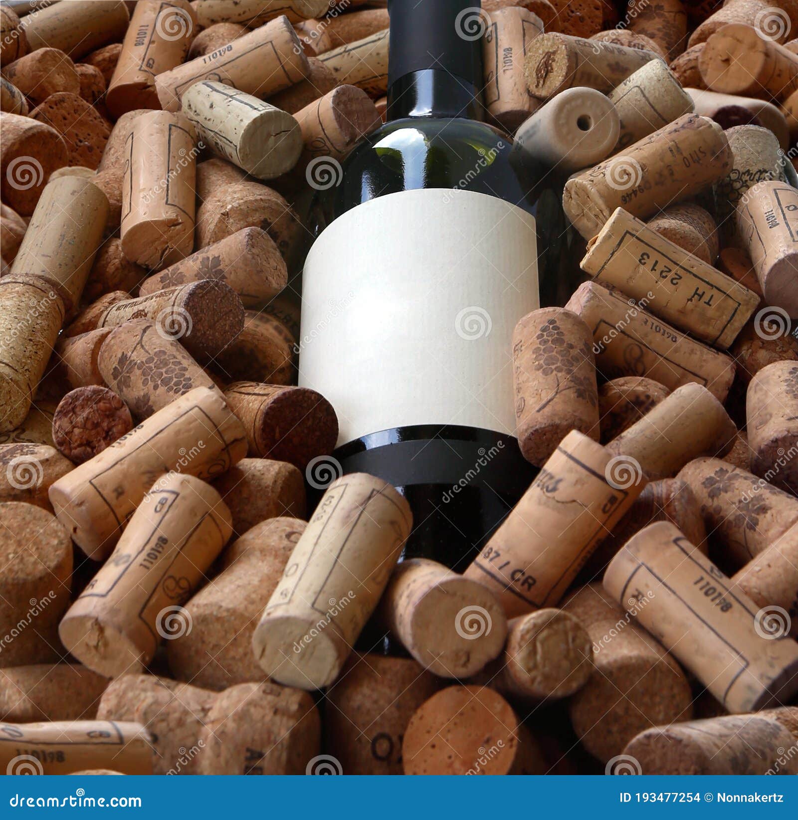 Sealed Wine Bottle with Labels Immersed in Used Corks Stock Photo ...
