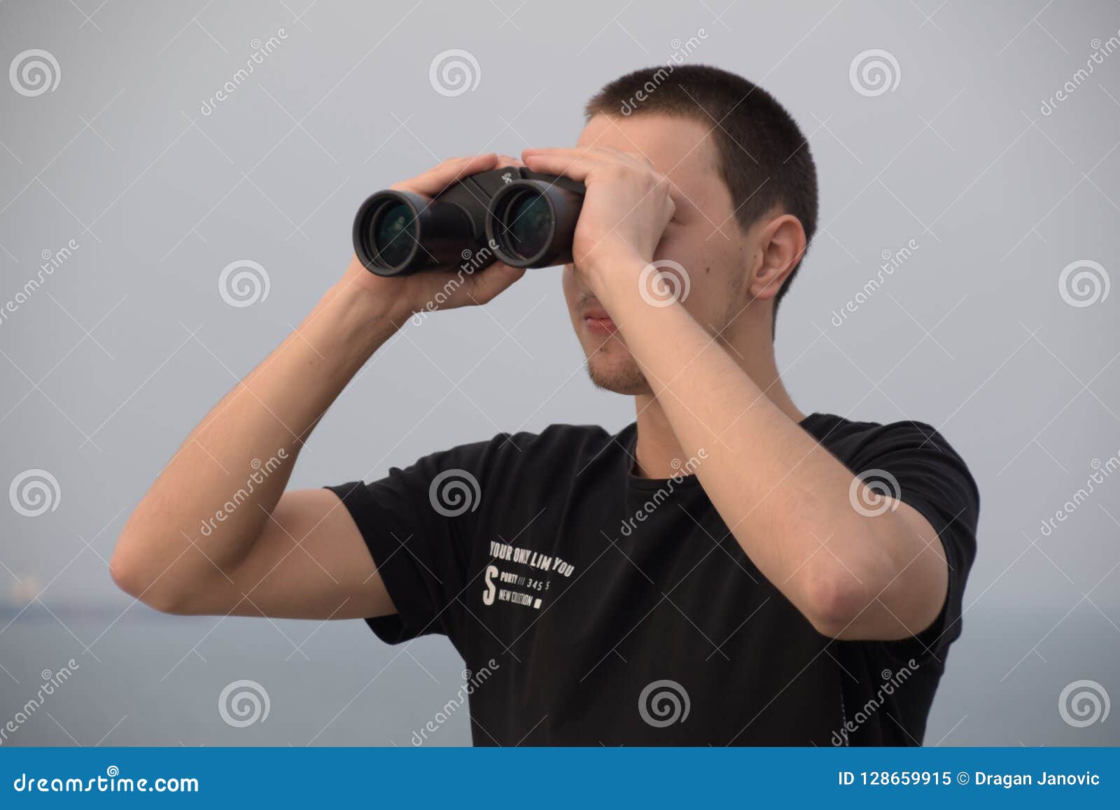 Seaman posing as a lookout stock image. Image of binocular - 128659915