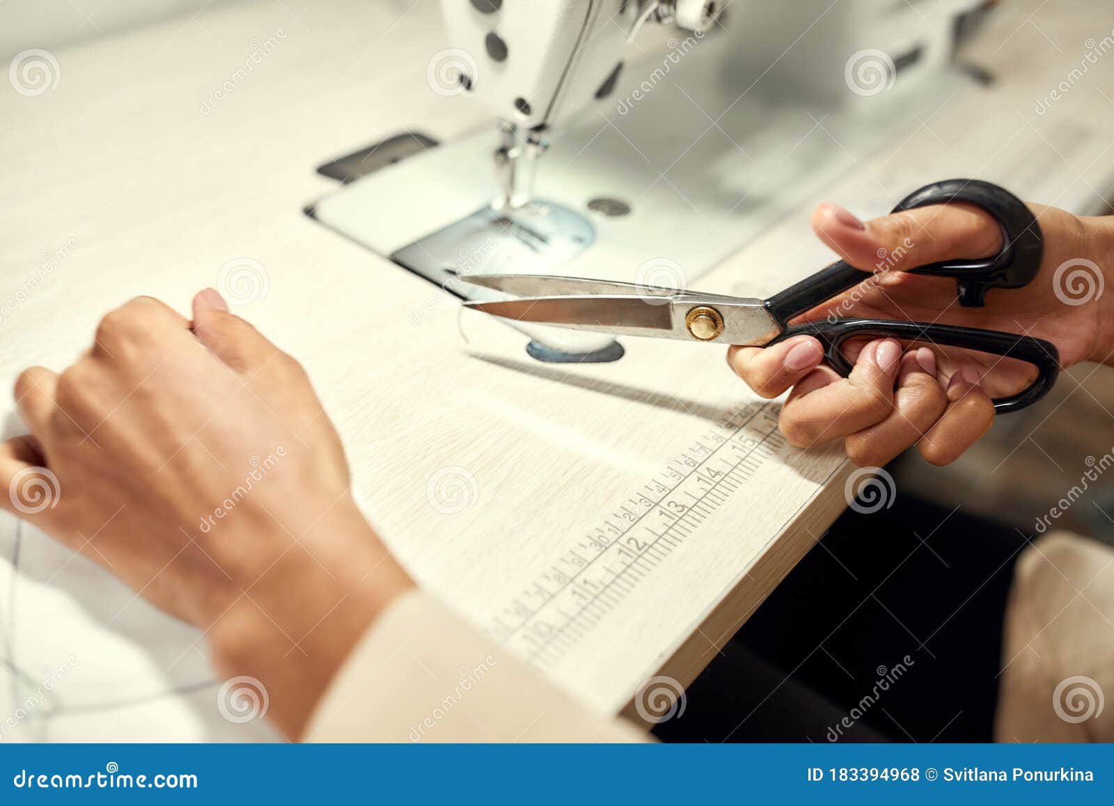 Measure Twice. Cut Once. Close Up of Seamstress Hands. she is Cutting ...