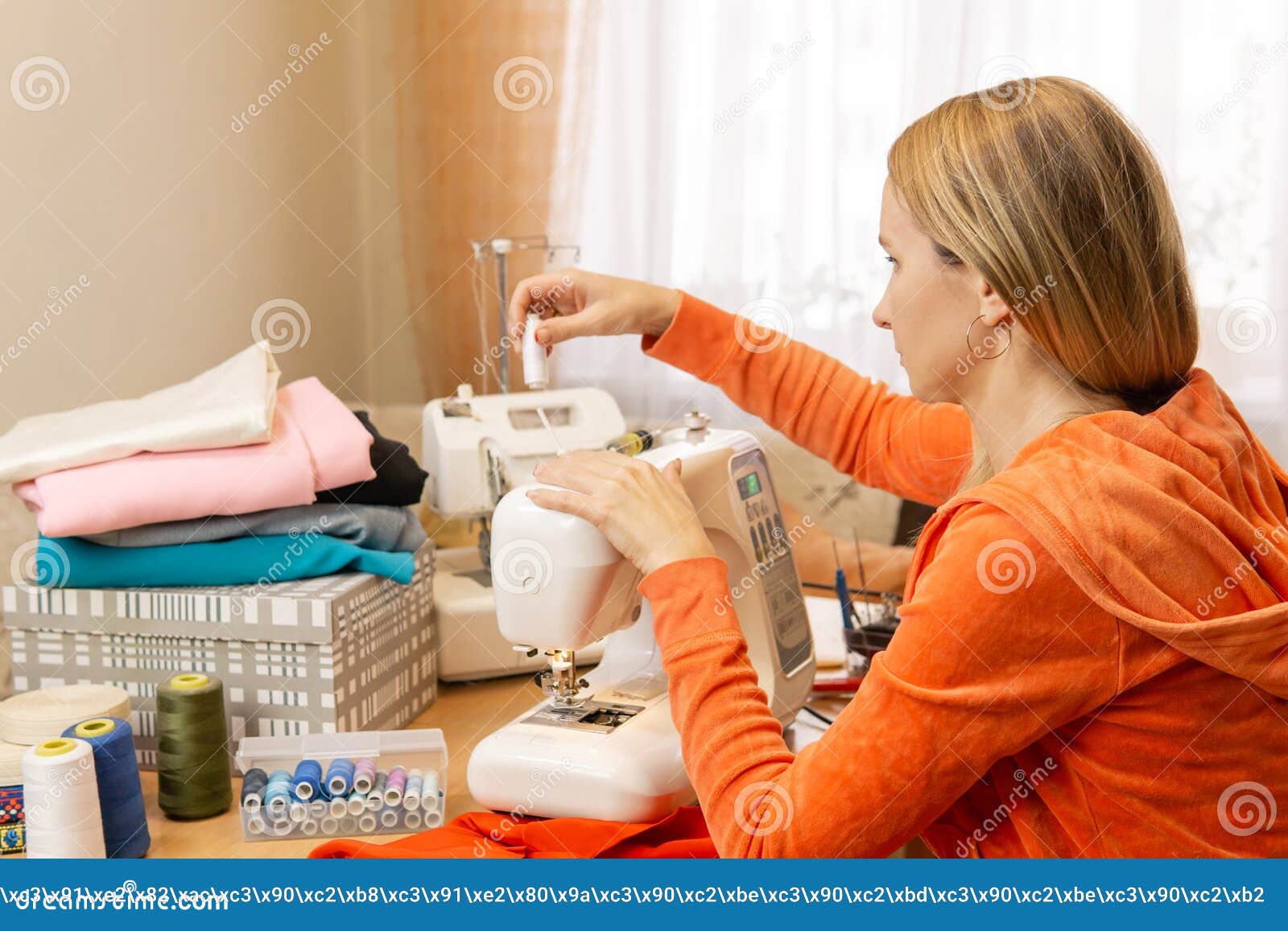 Seamstress Equips Spool of Thread on a Home Sewing Machine Stock Photo ...