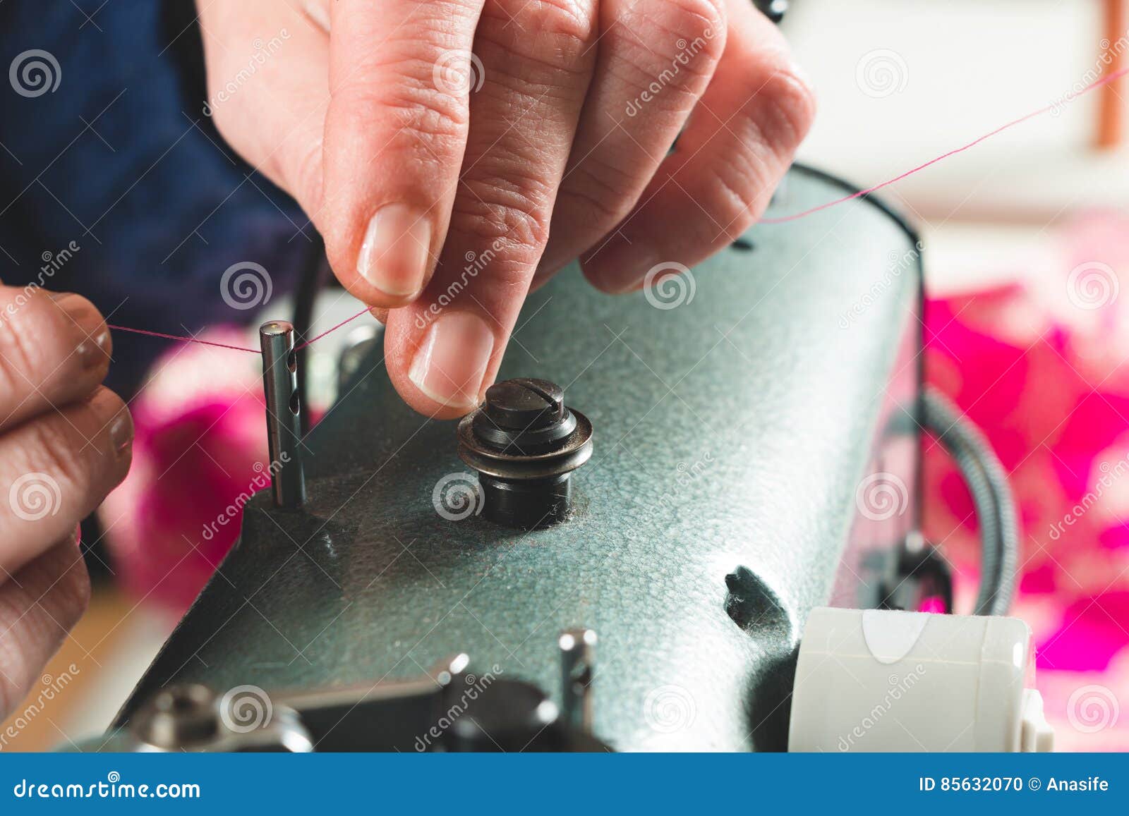 Seamstress Hands Placing Thread in Sewing Machine Stock Photo - Image ...