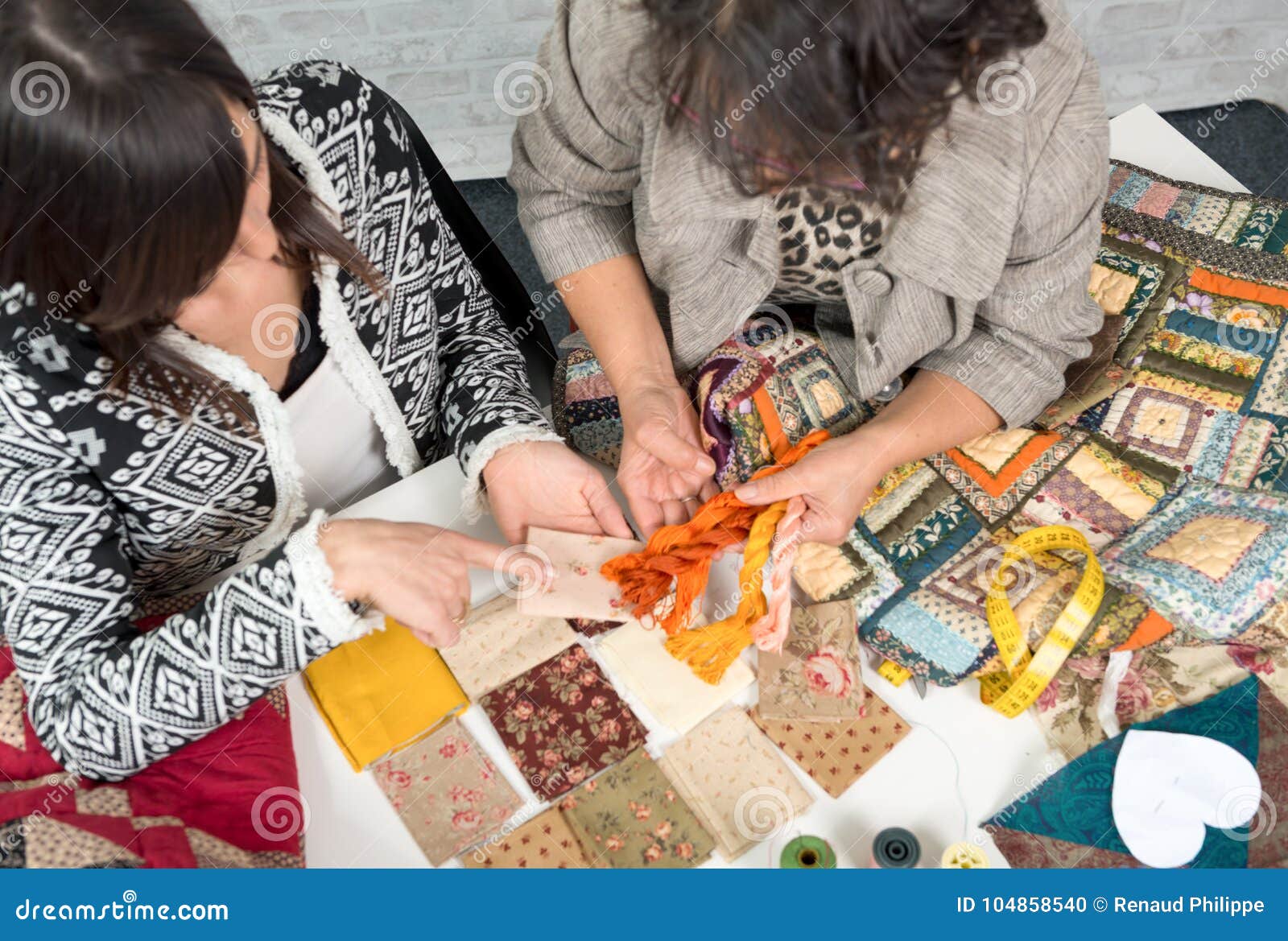 Seamstress and Her Apprentice Choose Fabric for Patchwork Stock Photo ...