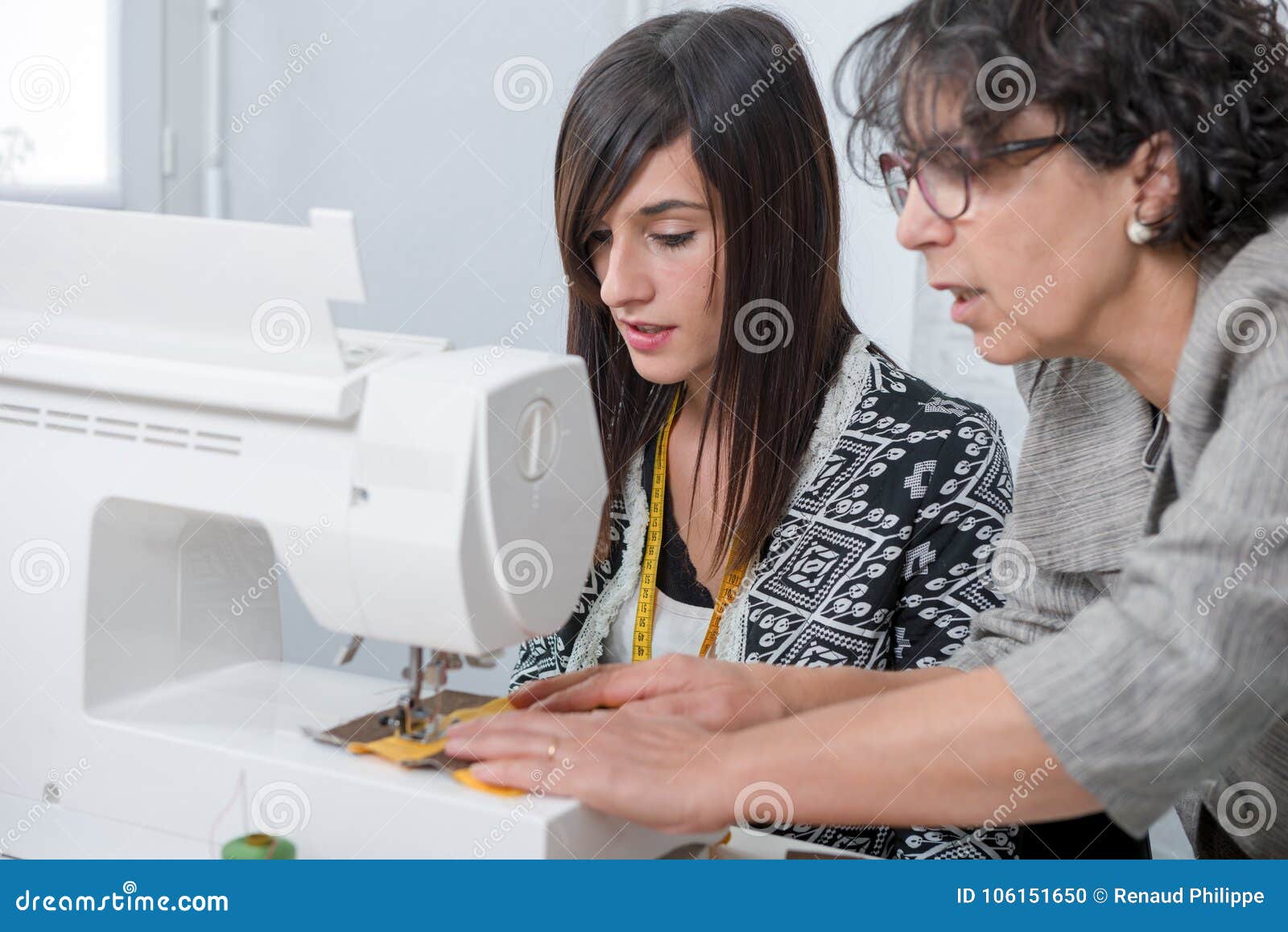 Seamstress and Her Apprentice with Sewing Machine Stock Photo - Image ...