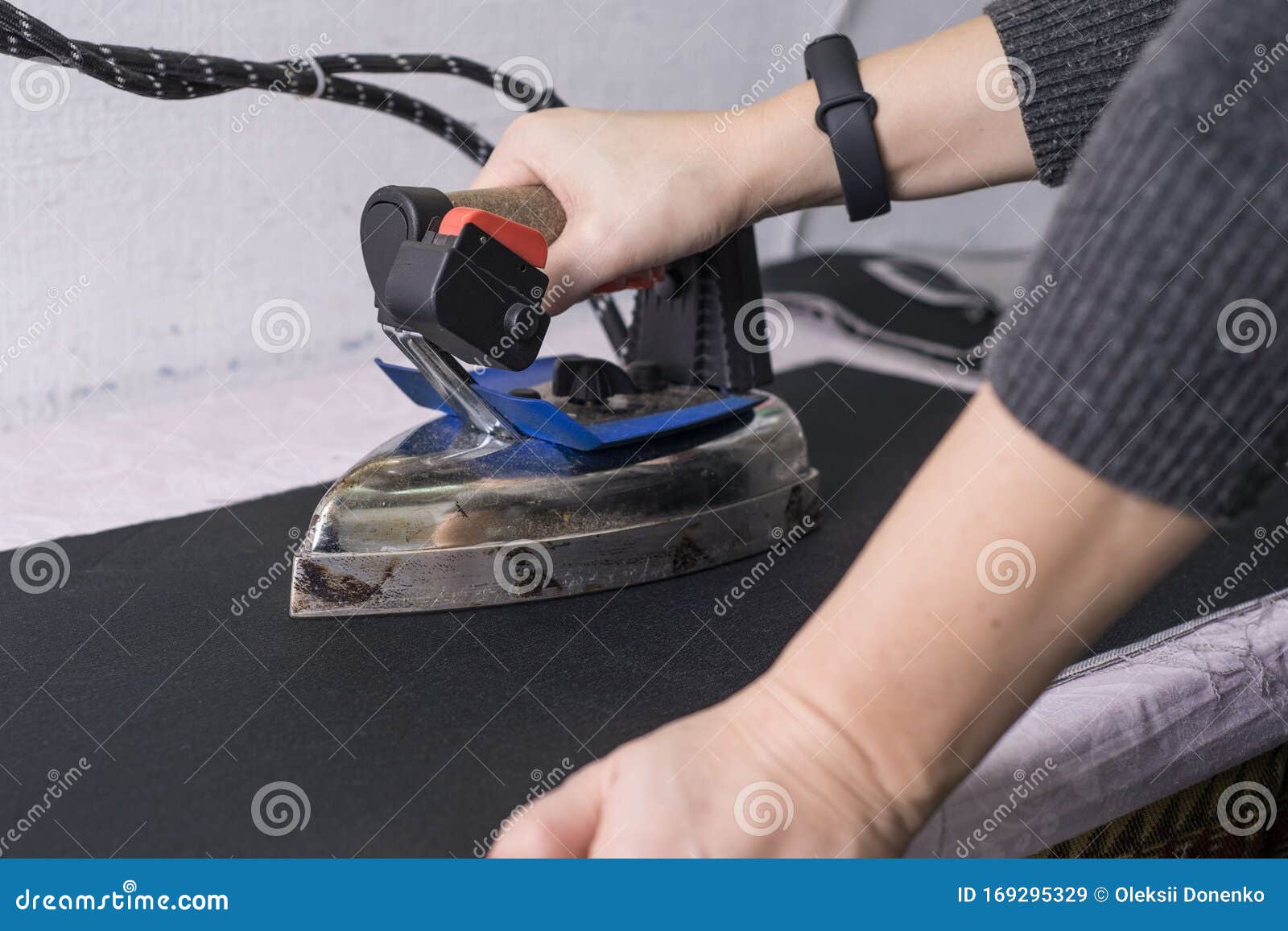 Seamstress Master, in the Sewing Salon, Using the Iron, the Master ...