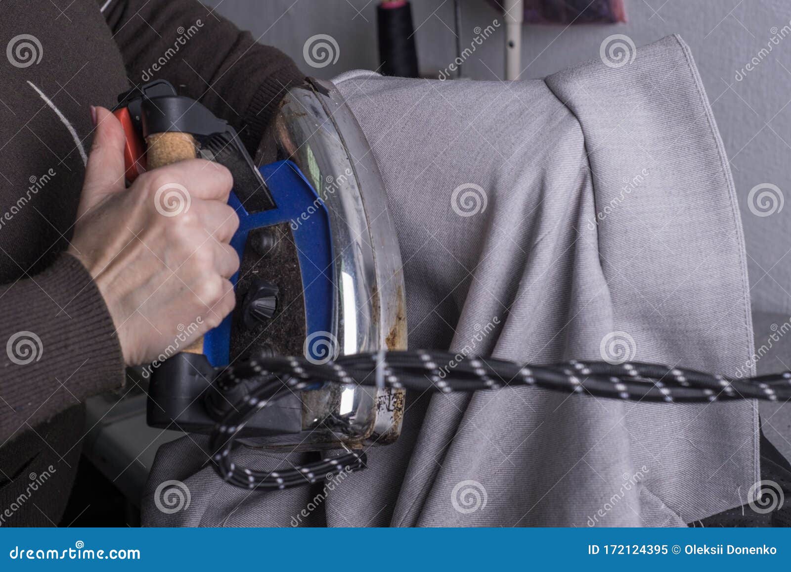 Seamstress Master, in the Sewing Salon, Using the Iron, the Master ...