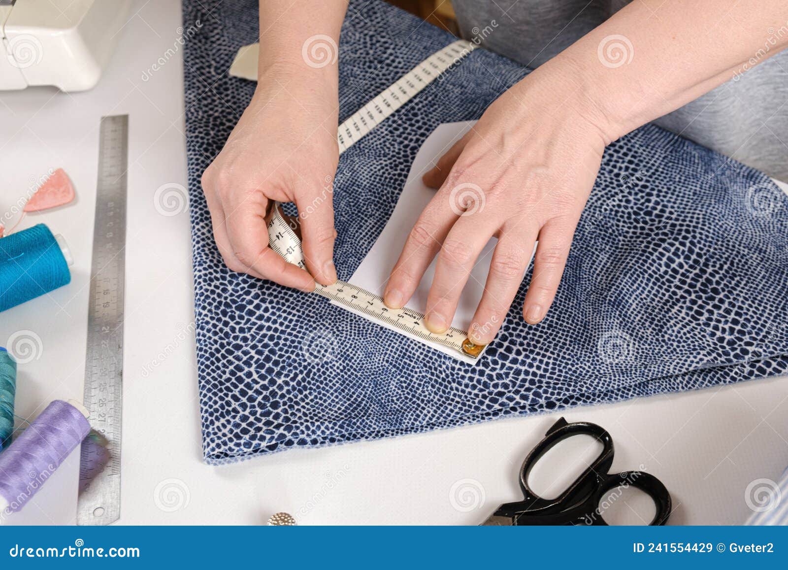Seamstress Measures the Width of the Pattern Piece with a Flexible ...