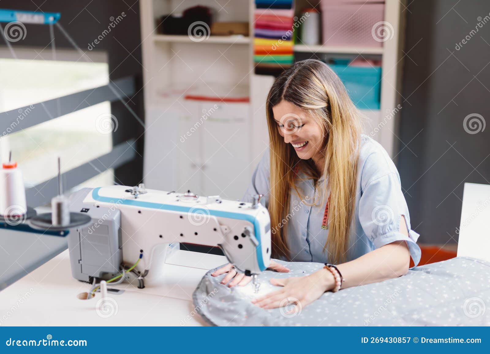 Seamstress Smiling Woman Working with Sewing Machine in Workshop Stock ...