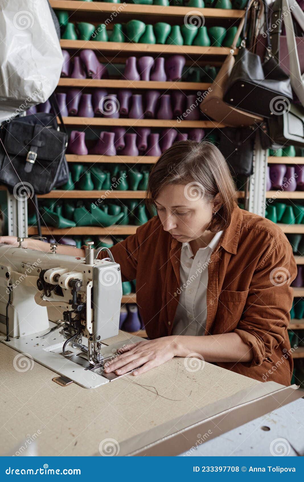 Seamstress Using Sewing Machine at Workplace Stock Photo - Image of ...