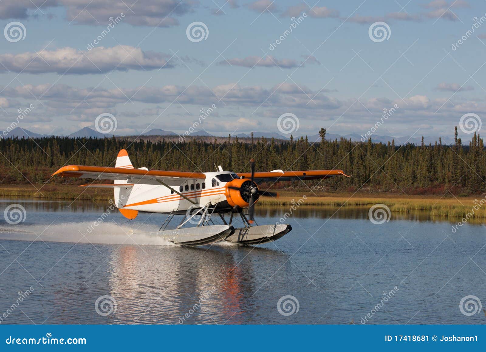 Seaplane Landing on an Alaskan Lake Stock Image - Image of circle ...