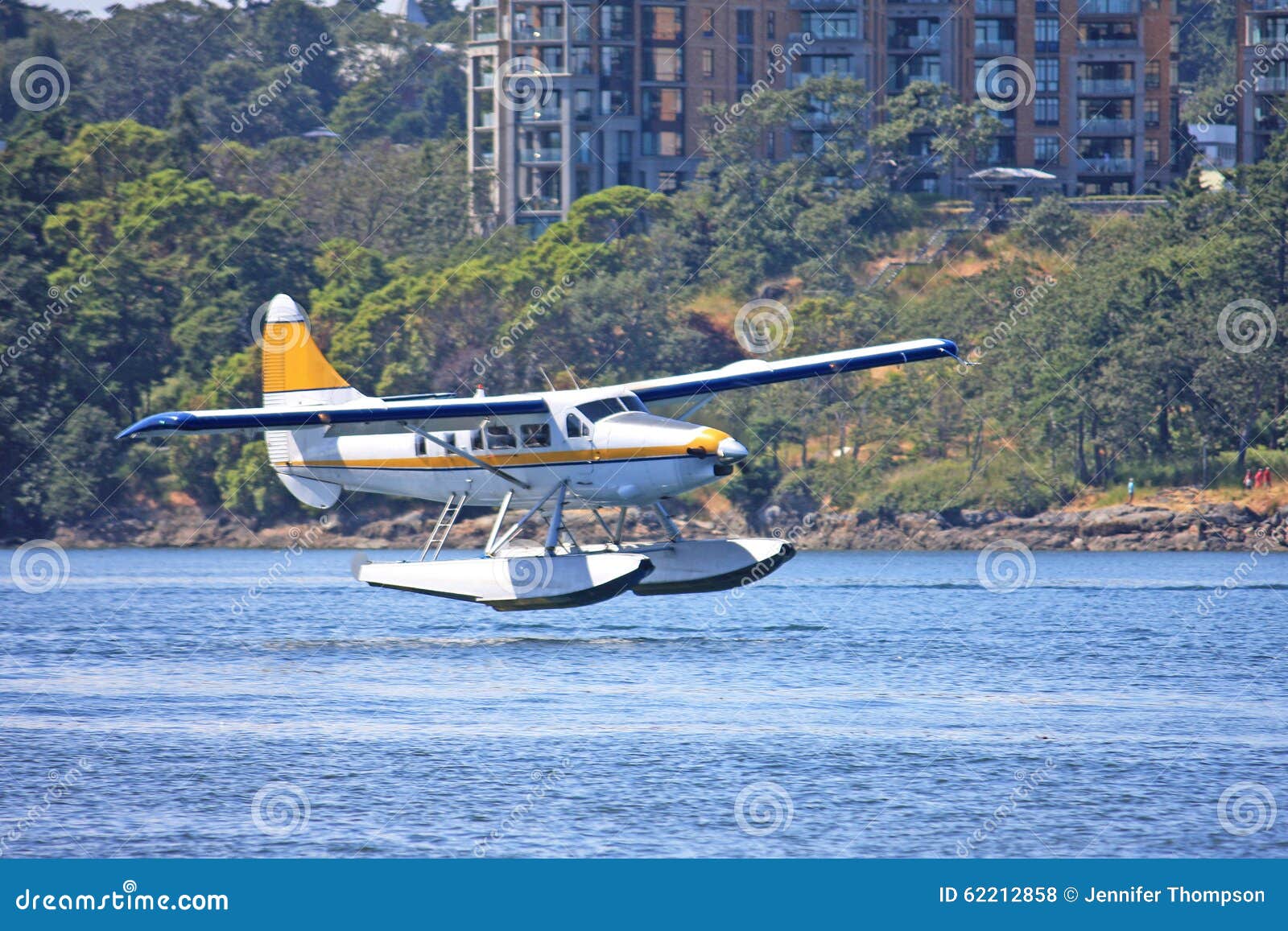 Seaplane Landing In The Ocean Lagoon. Seaplane Takeoff From The Stock ...