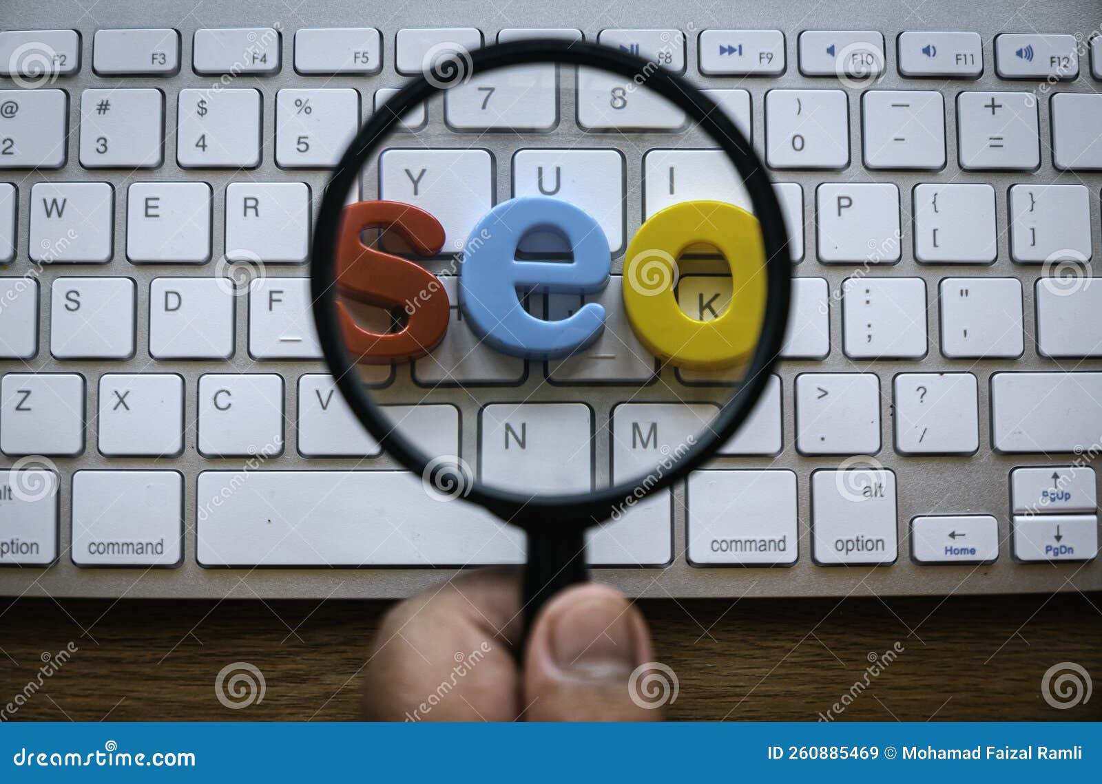 Search Engine Optimization Concept. a Hand Holding Magnifying Glass ...