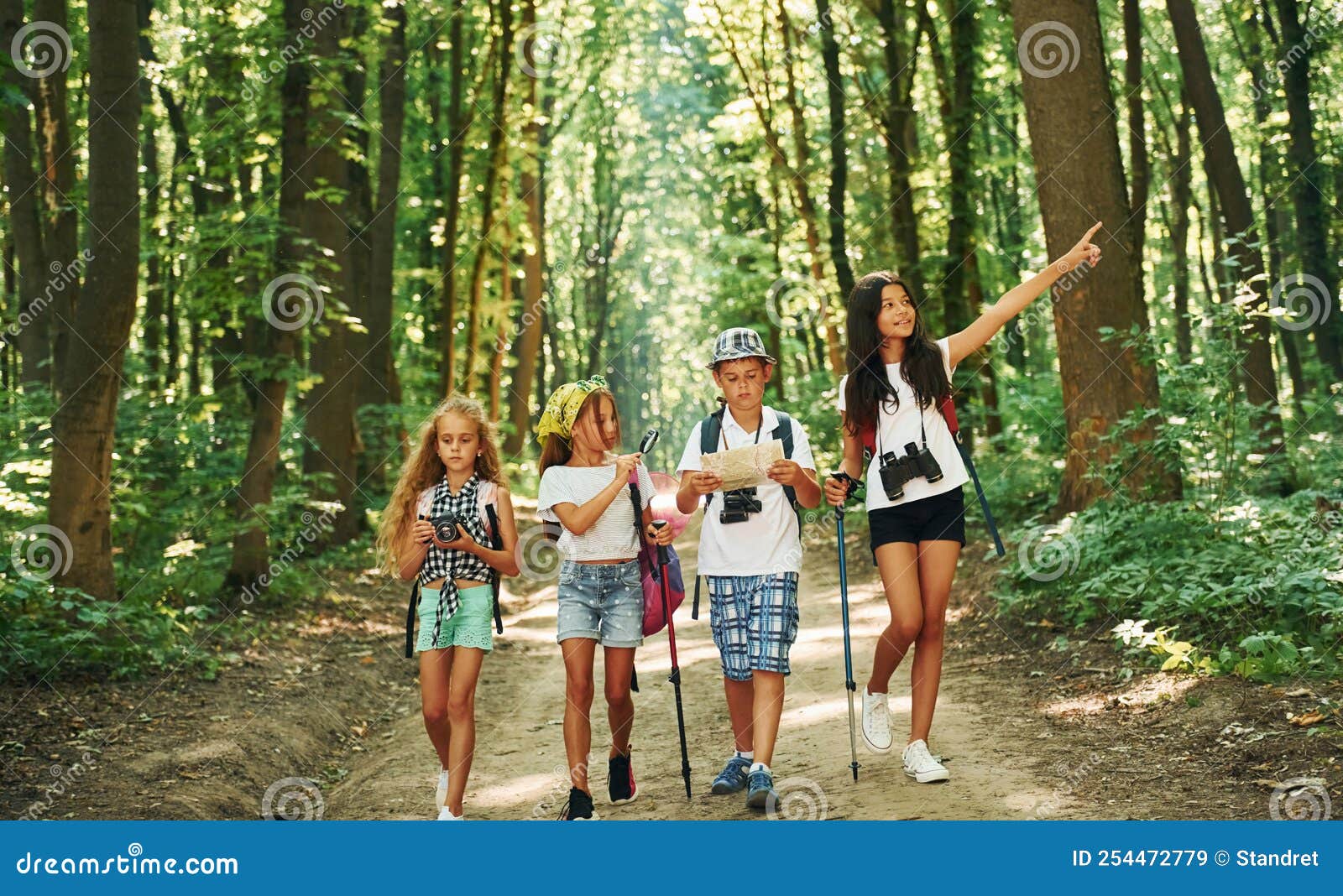 Searching for the Path. Kids Strolling in the Forest with Travel ...