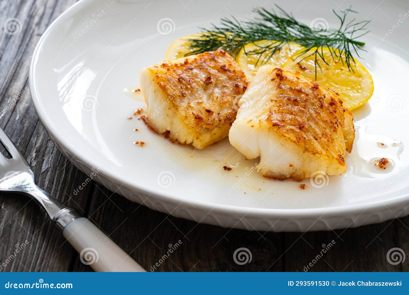 Seared Cod Loin and Sliced Lemon on Wooden Table Stock Photo - Image of ...