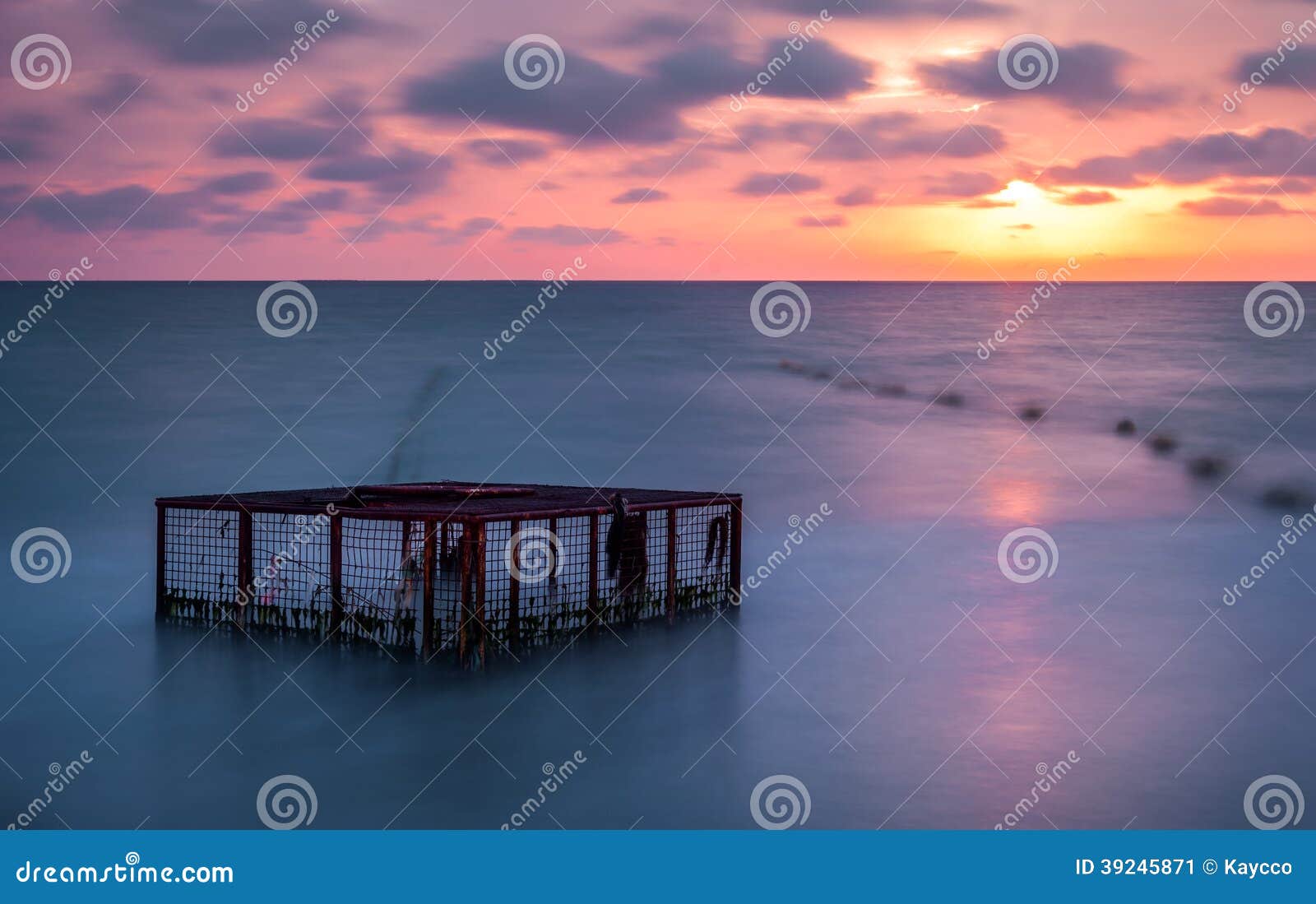 Seascape and Empty Cage at Colorful Sunset Stock Image - Image of ...