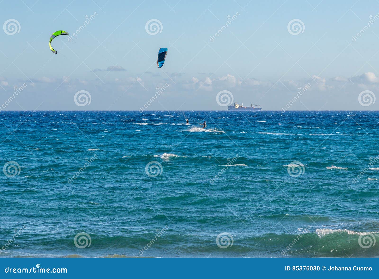 Seascape of Kite Surfers and a Ship on the Horizon. Stock Photo - Image ...