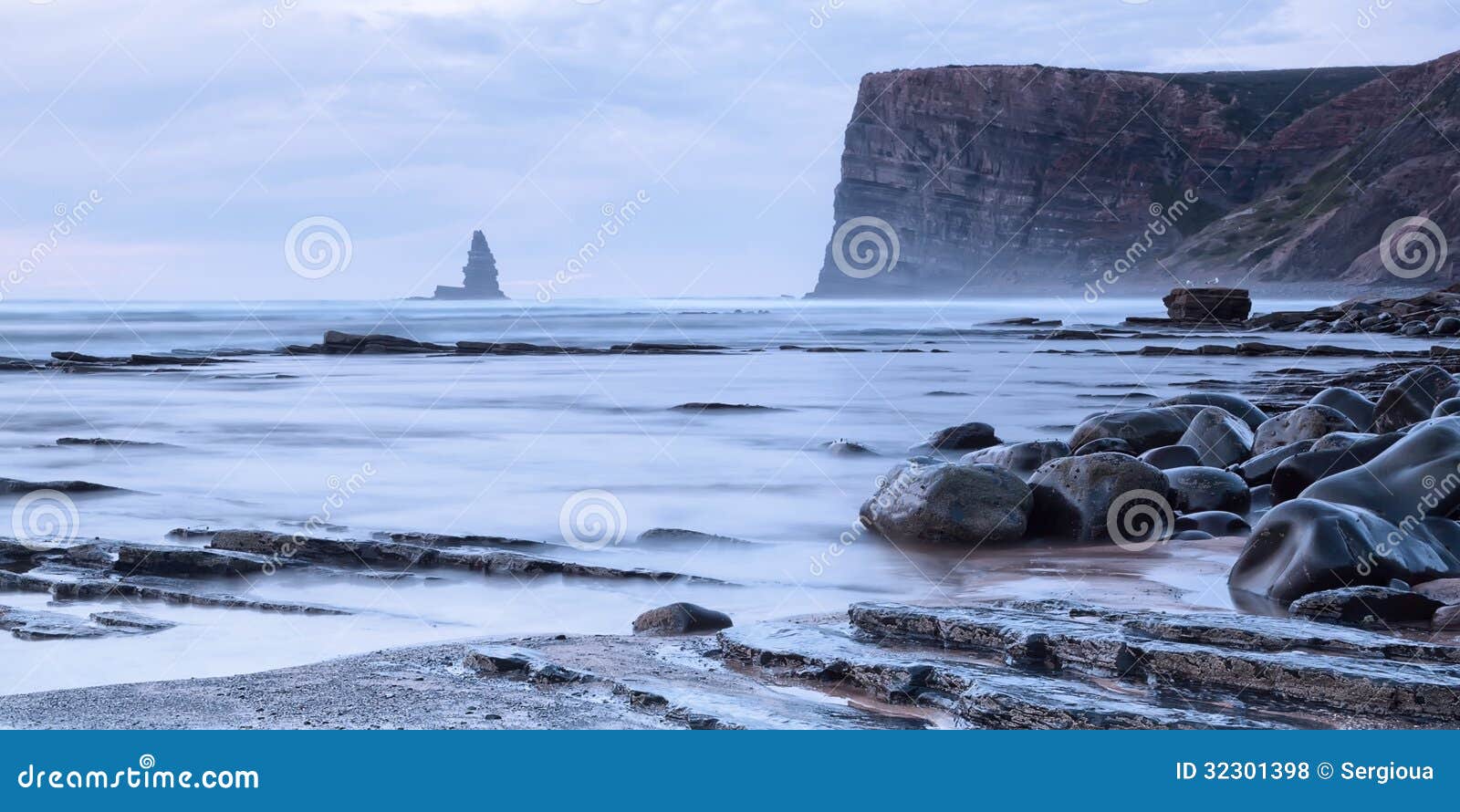 Seascape of Rocks and Sea at Sunset. Stone Needle Stock Photo - Image ...