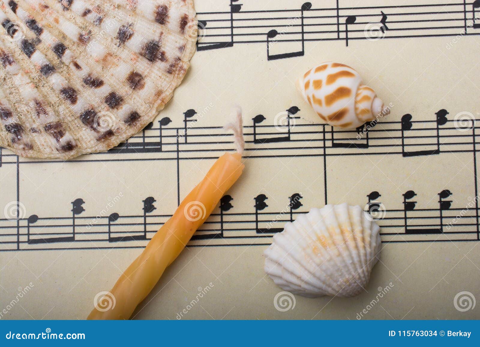 Seashells and Candle on a Musical Notes Stock Photo - Image of linen ...