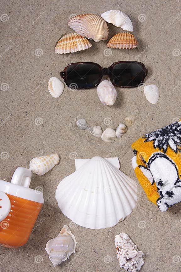Seashells face in the sand stock photo. Image of vacation - 9998452