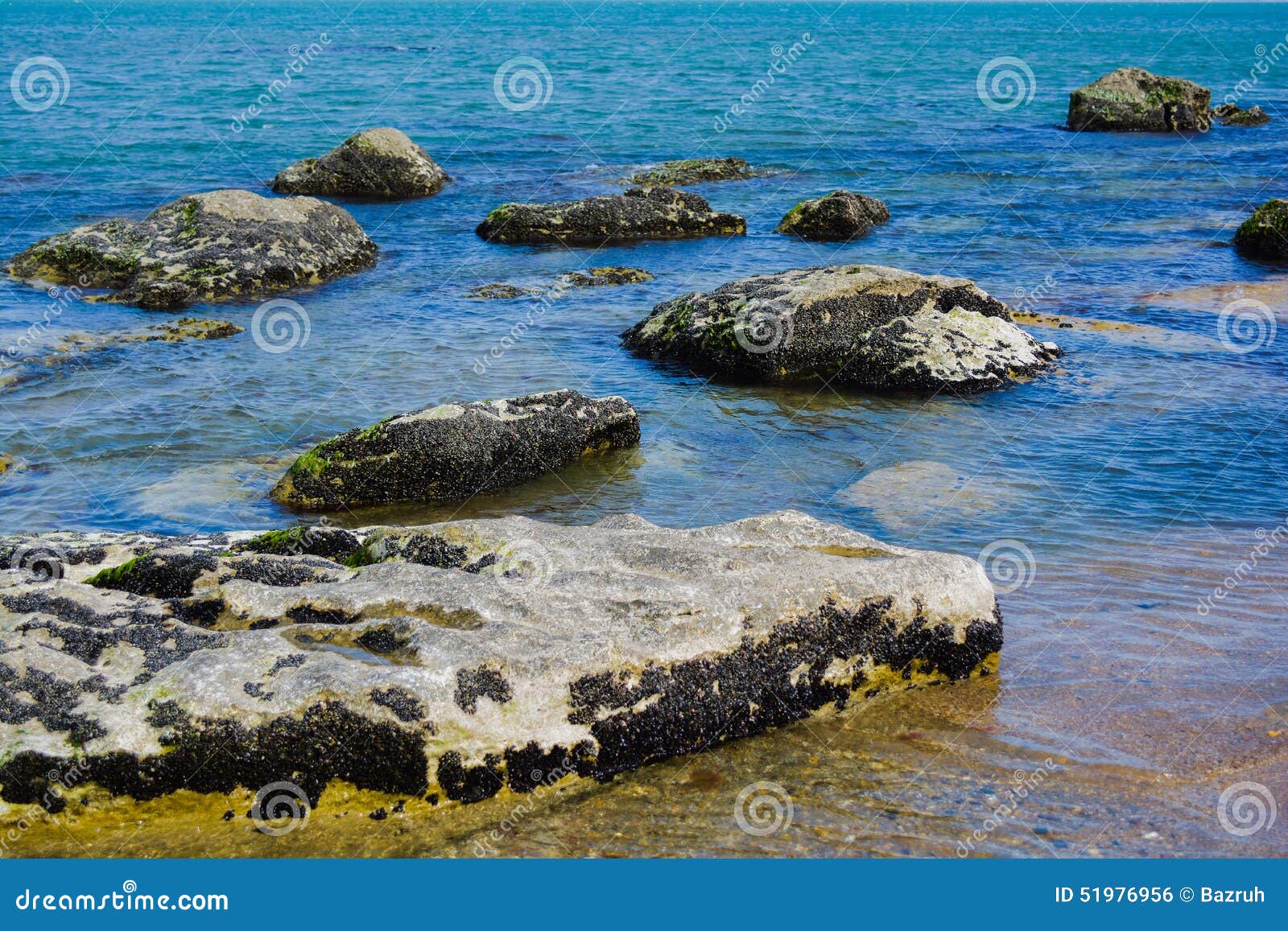 Seashore, Rocks, Blue Water Stock Photo - Image of warmly, cockleshells ...