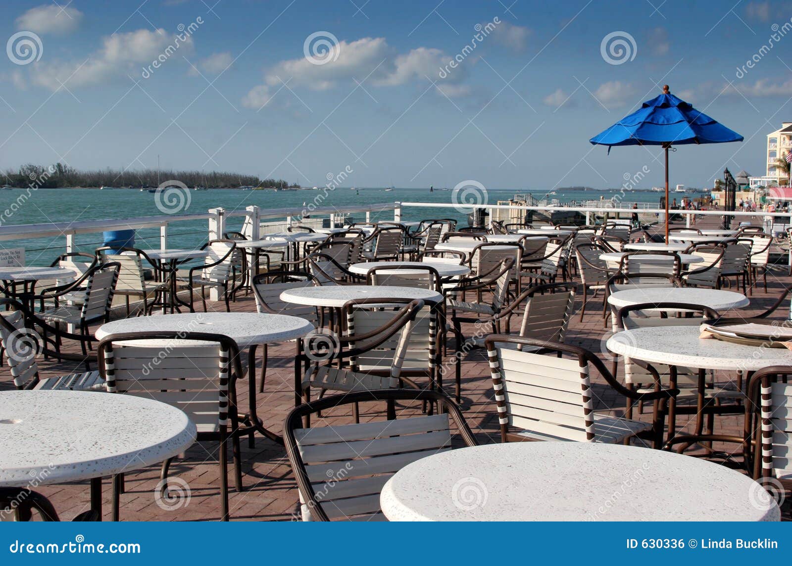 Seaside Dining stock photo. Image of tables, blue, dinner - 630336