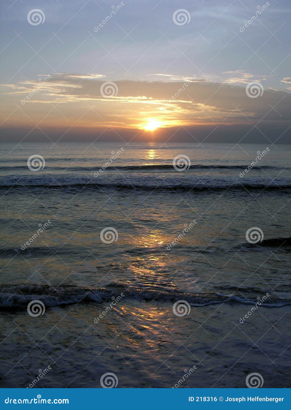Seaside Sunrise stock photo. Image of skies, rising, puffy - 218316