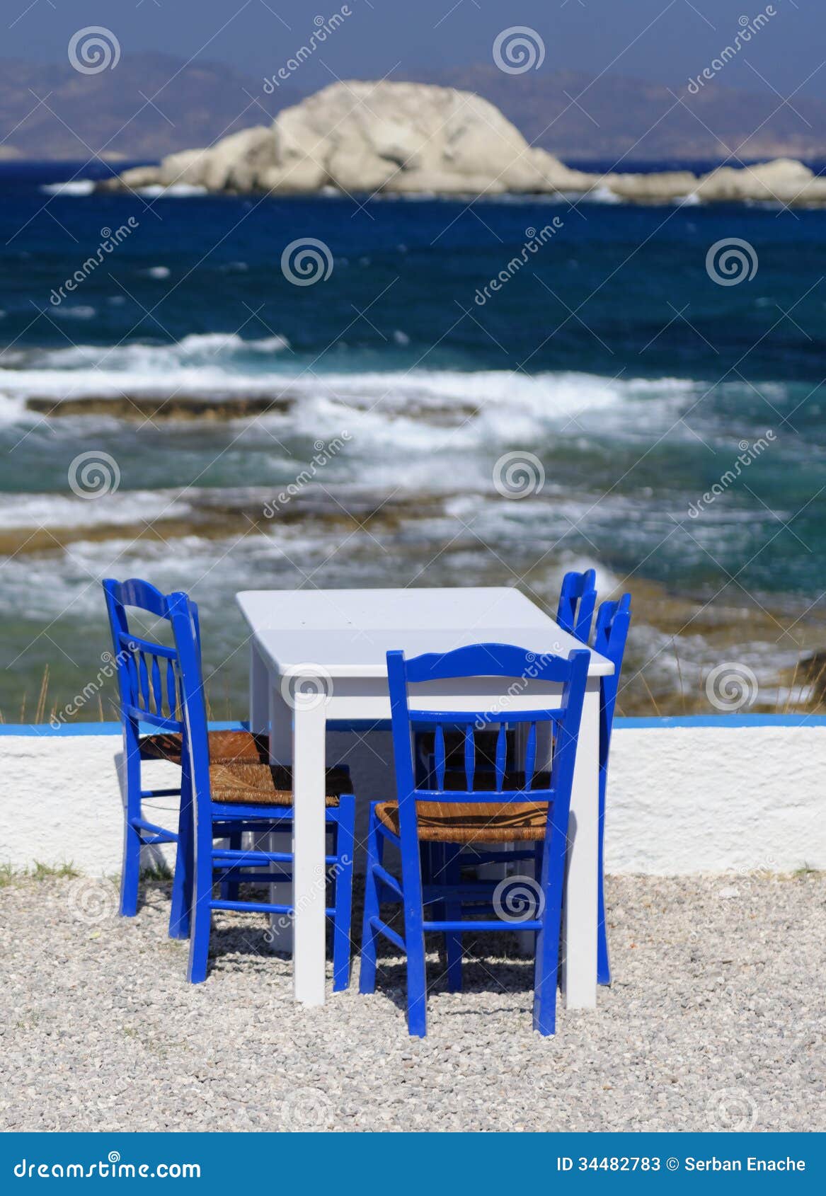 Seaside table and chairs stock image. Image of oceanfront - 34482783