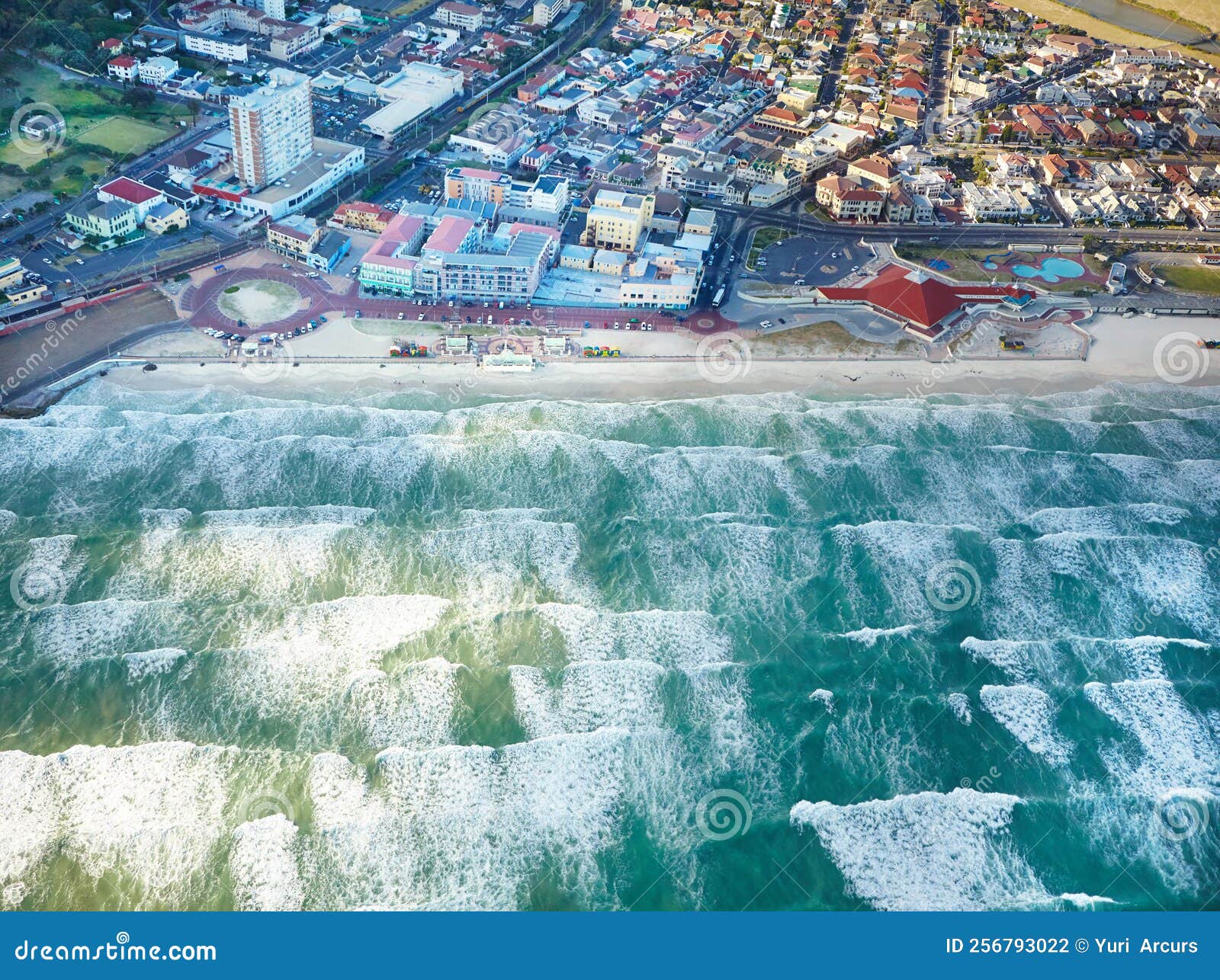 Seaside Town. Aerial Shot of Ocean Waves and a Small Seaside Town ...