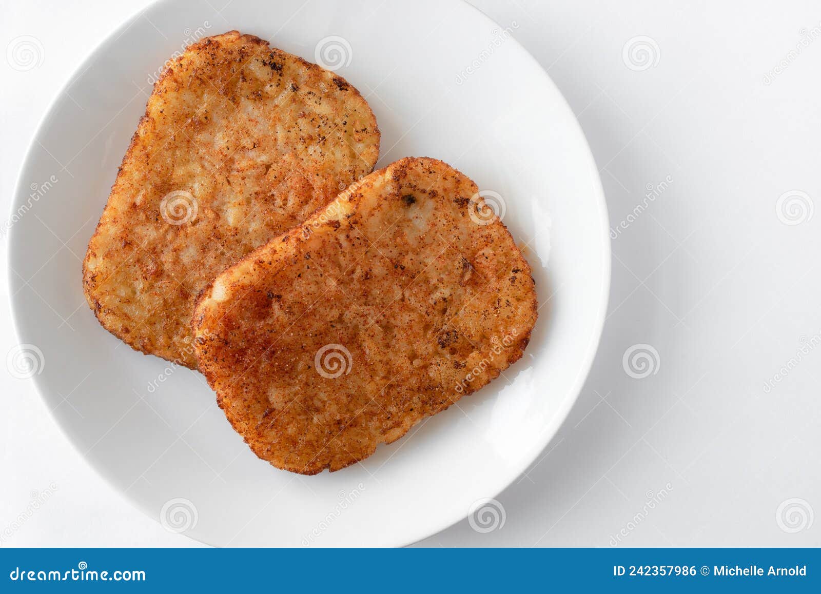 Seasoned Hash Browns on a Plate Stock Photo - Image of patties ...