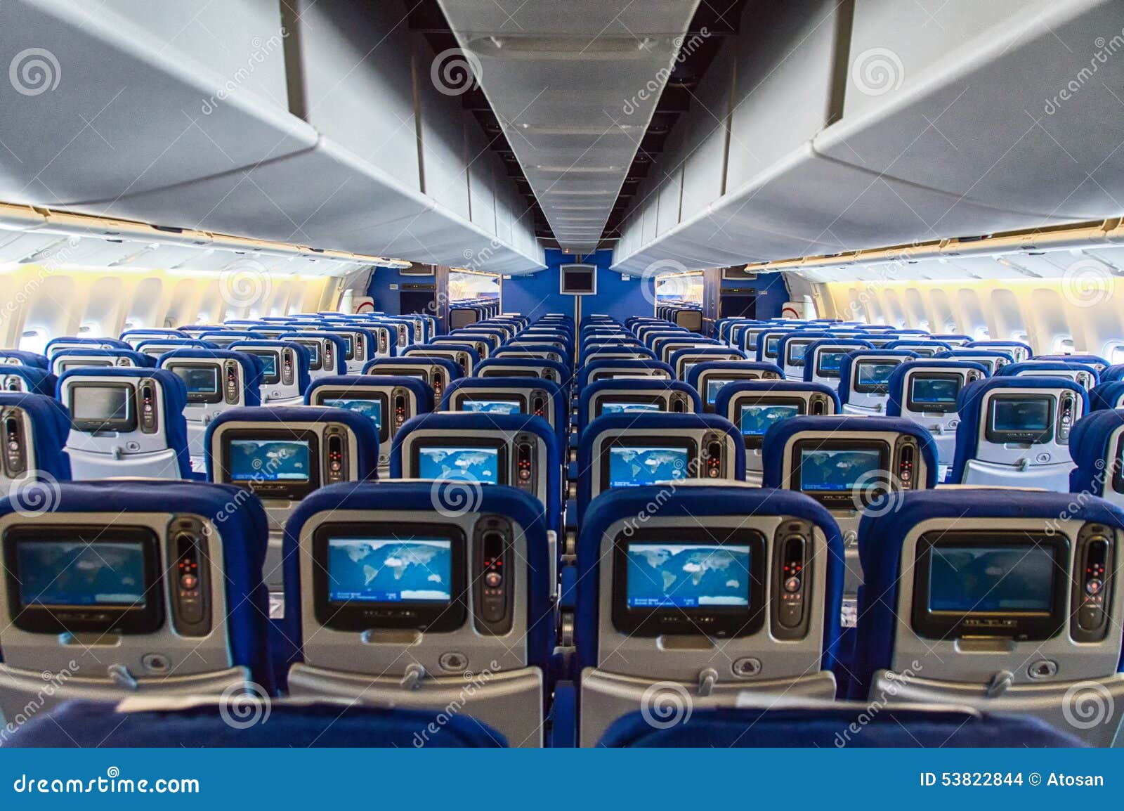 Seat Rows with Video Screens Inside an Airplane Stock Photo - Image of ...