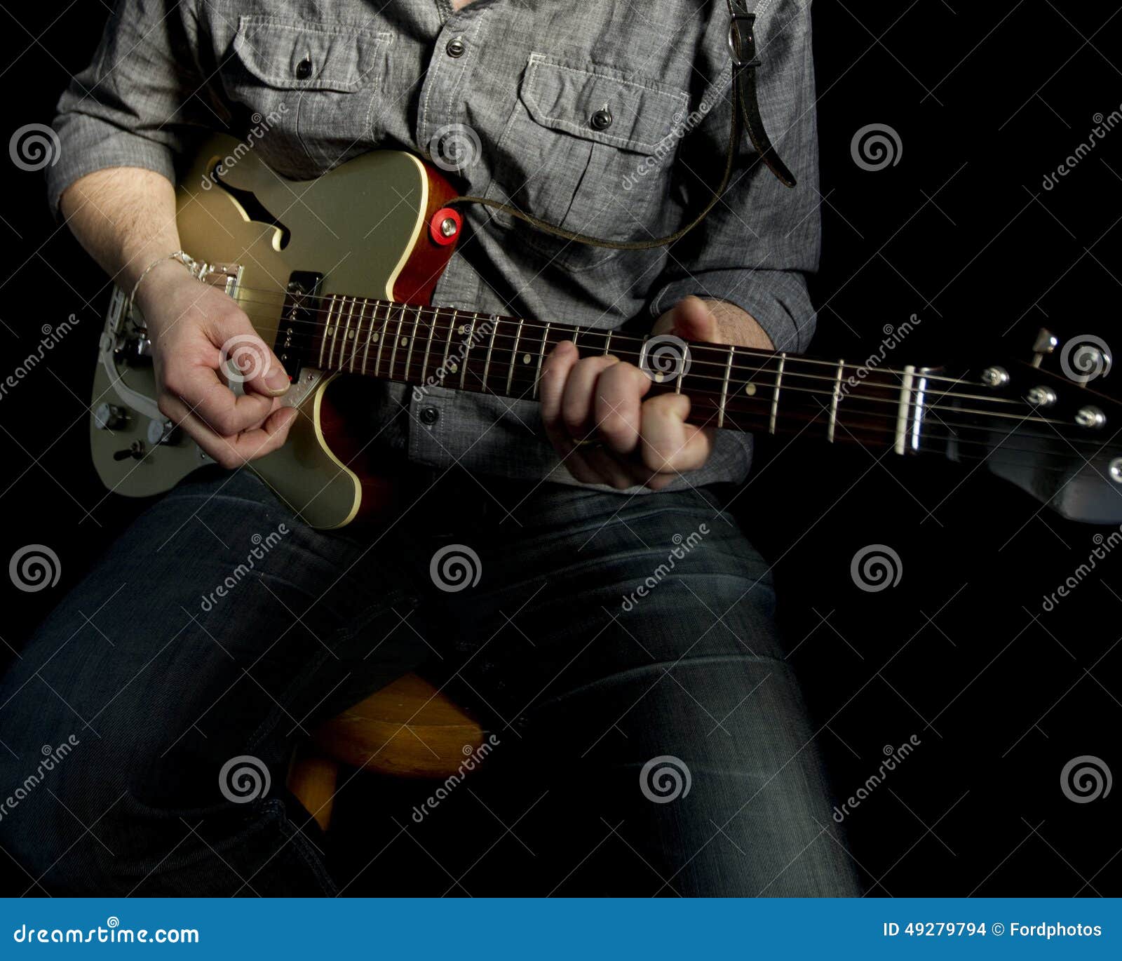 Seated Guitarist in Studio stock photo. Image of artist - 49279794