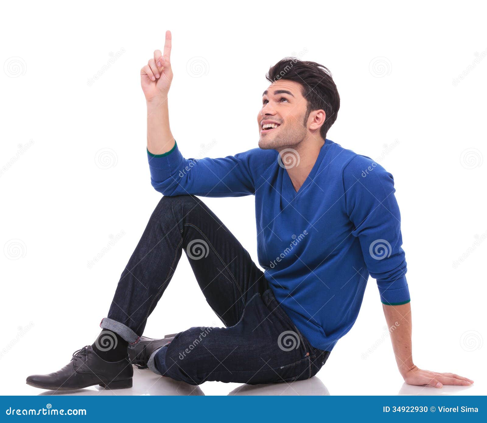 Seated Man is Pointing at Something Up Stock Photo - Image of choice ...