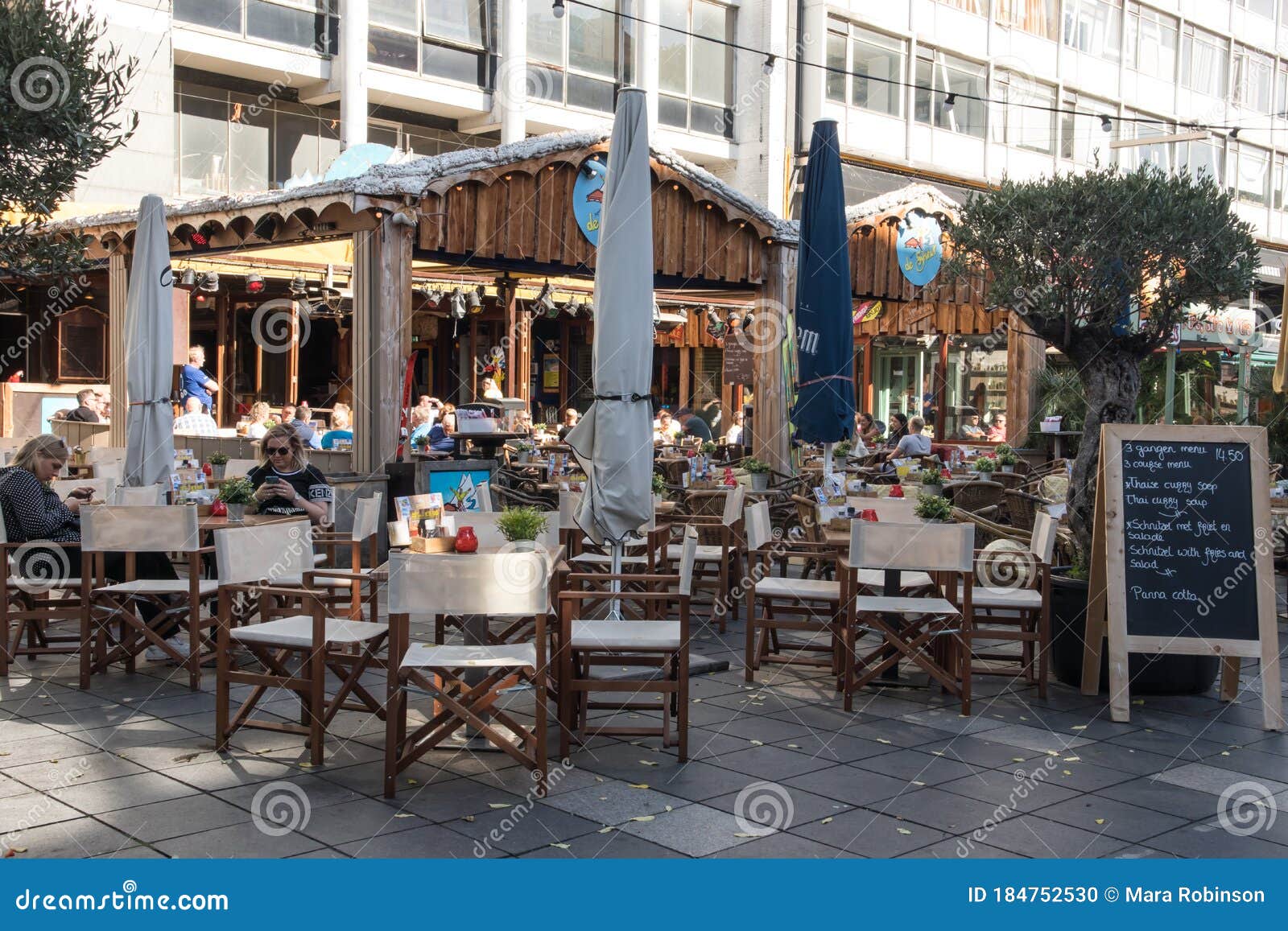Seating Area Outside a Cafe Bar Restaurant with Diners Editorial Image ...