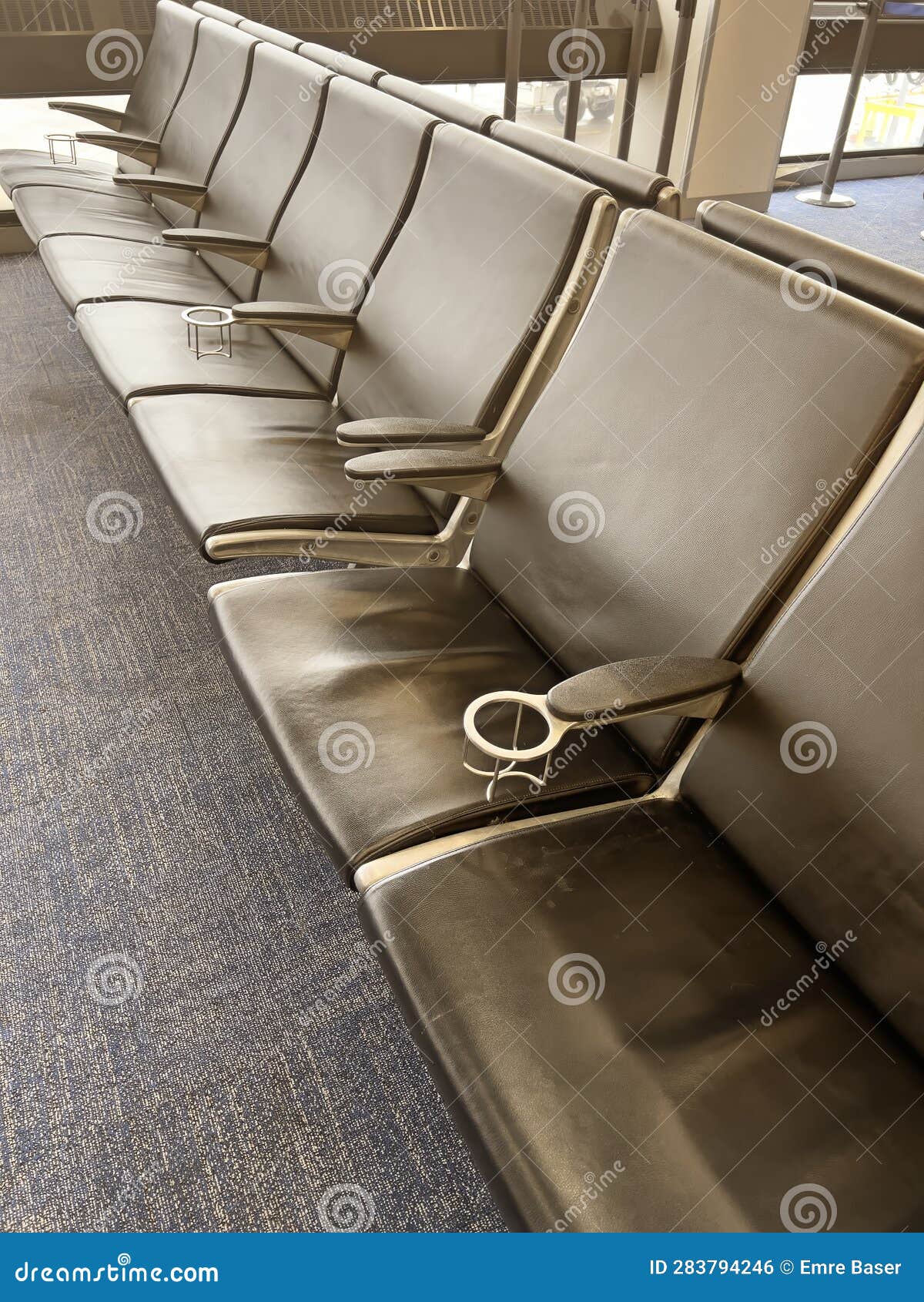 Seats at an airport gate stock photo. Image of waiting - 283794246
