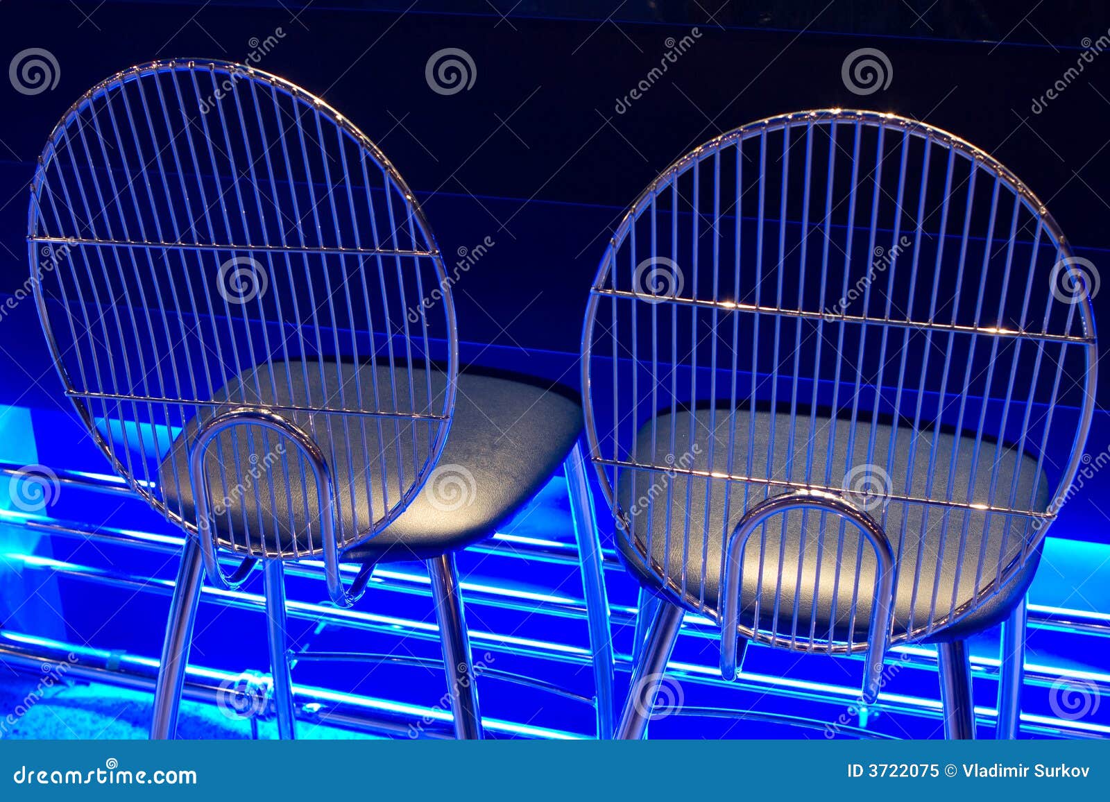 Seats with blue neon glow stock image. Image of hotel - 3722075