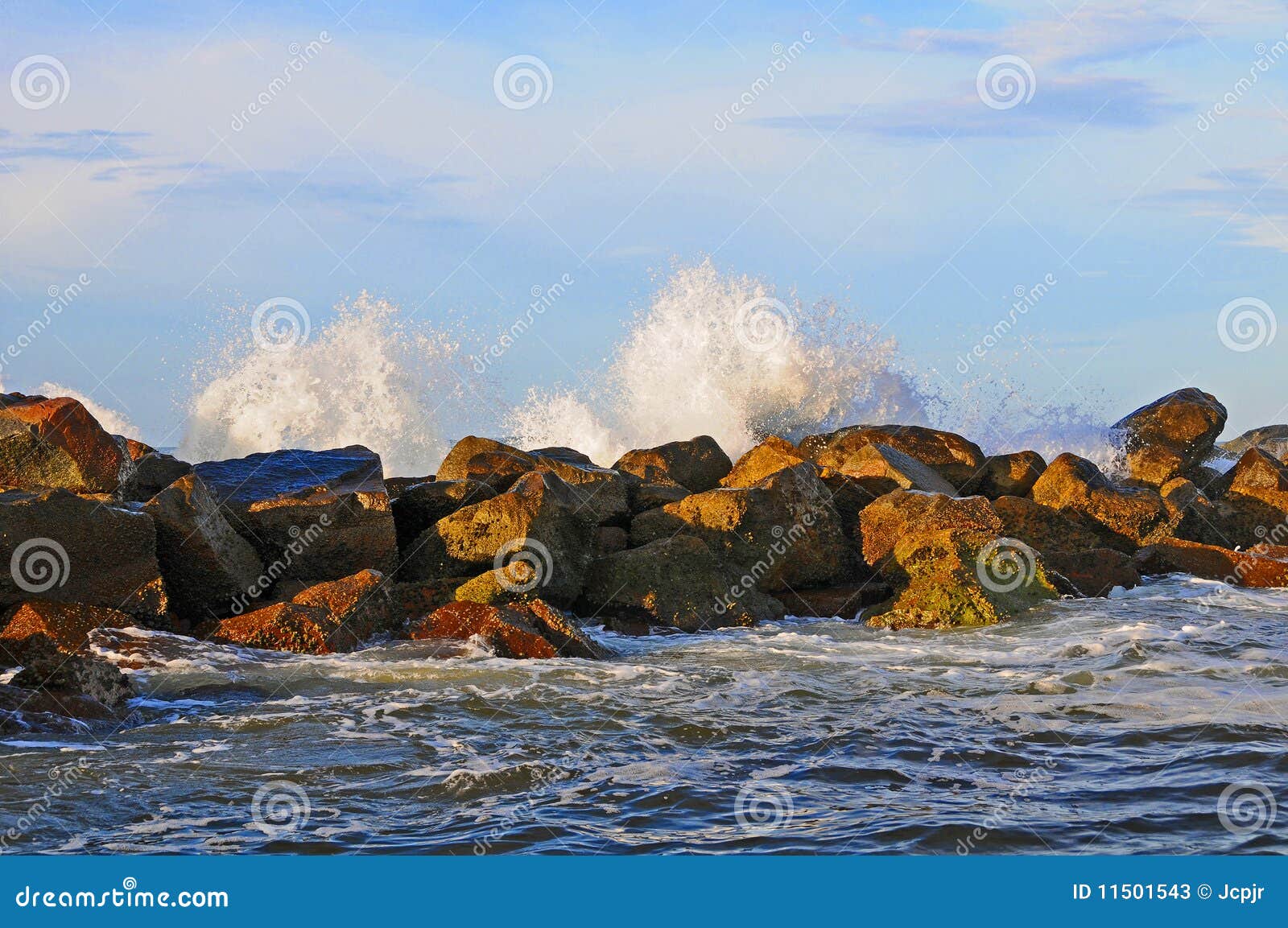 Seawall splash at sunset stock image. Image of rock, splash - 11501543
