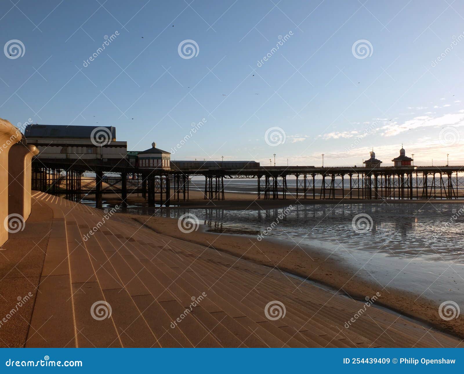 Seawall and Steps on Blackpool Beach at Sunset with the North Pier ...